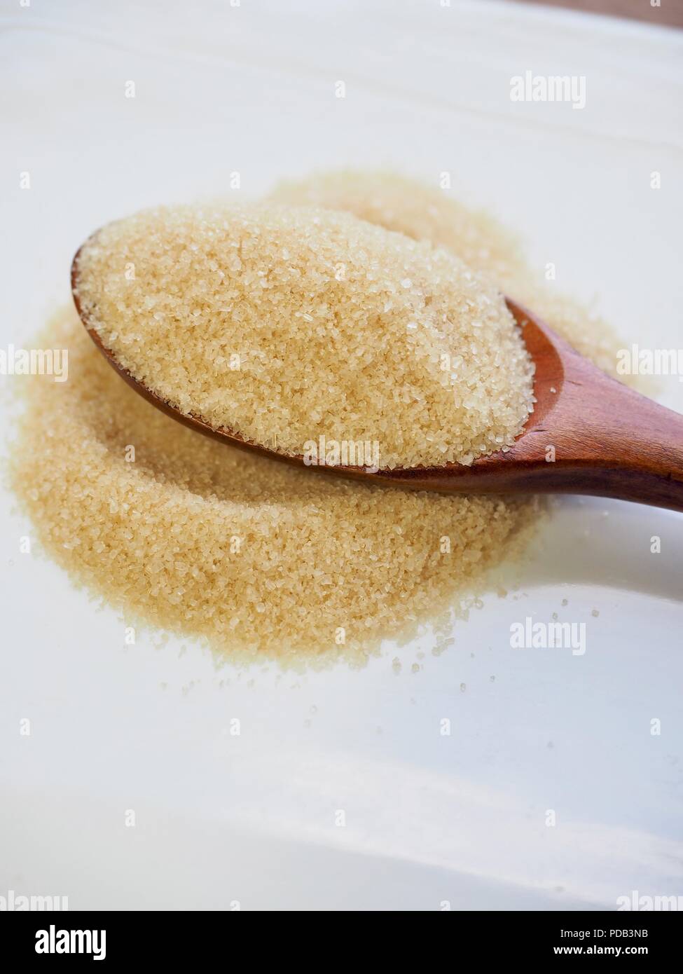 Brown powdered sugar in a spoon Stock Photo - Alamy