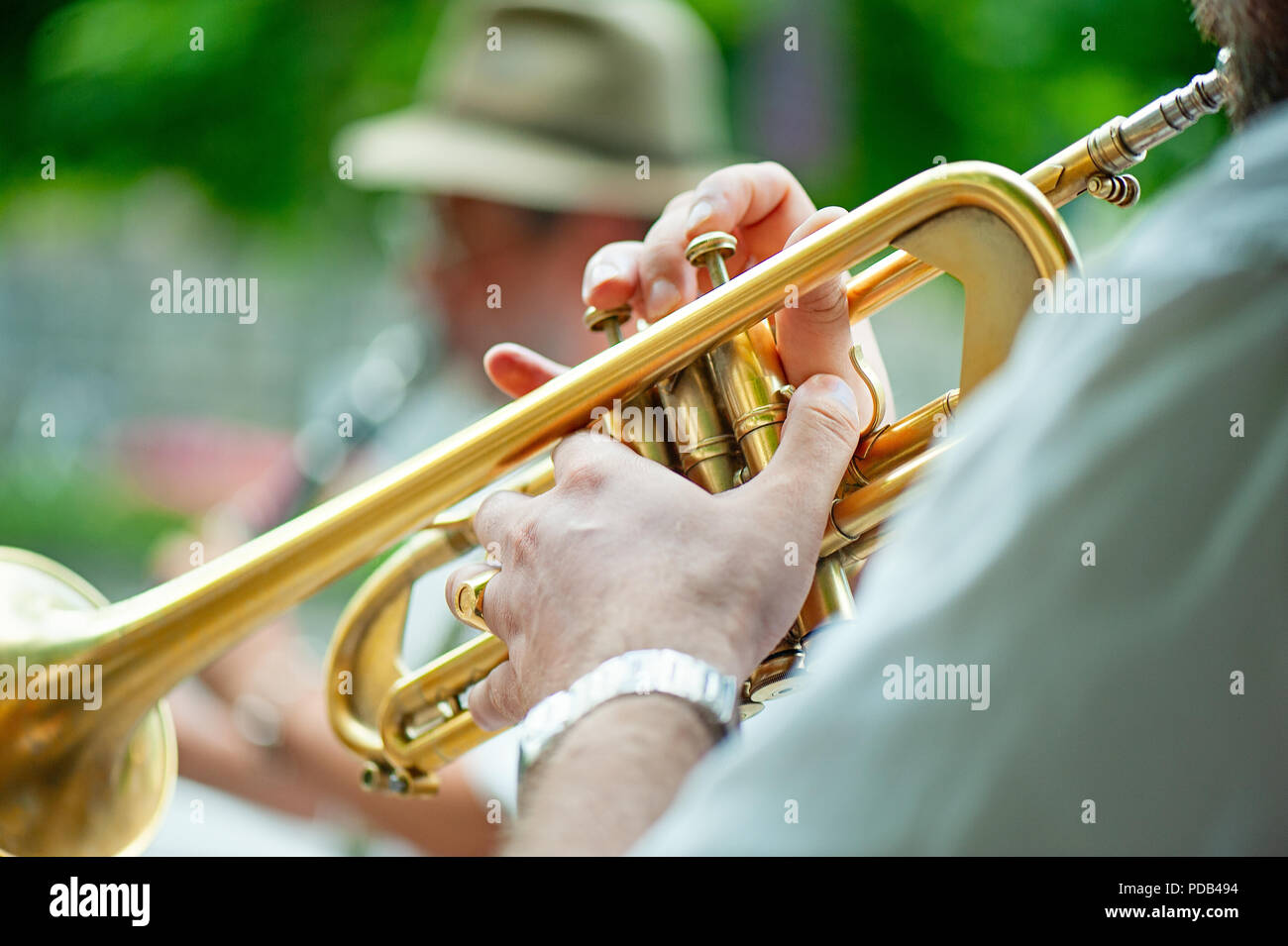 Trumpet player performs street performances with his group Stock Photo ...