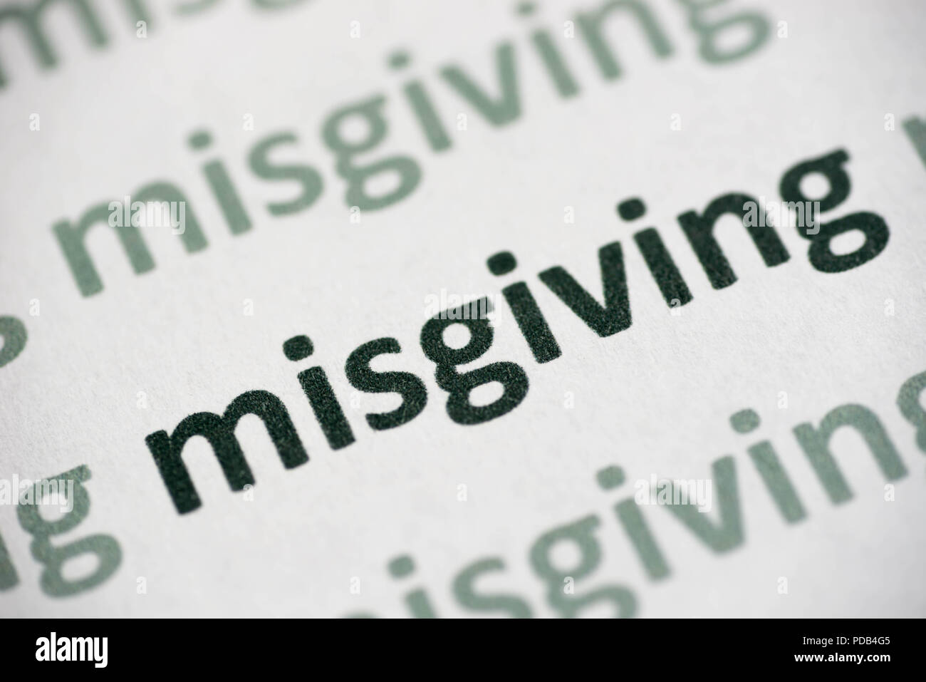 word misgiving printed on white paper macro Stock Photo - Alamy