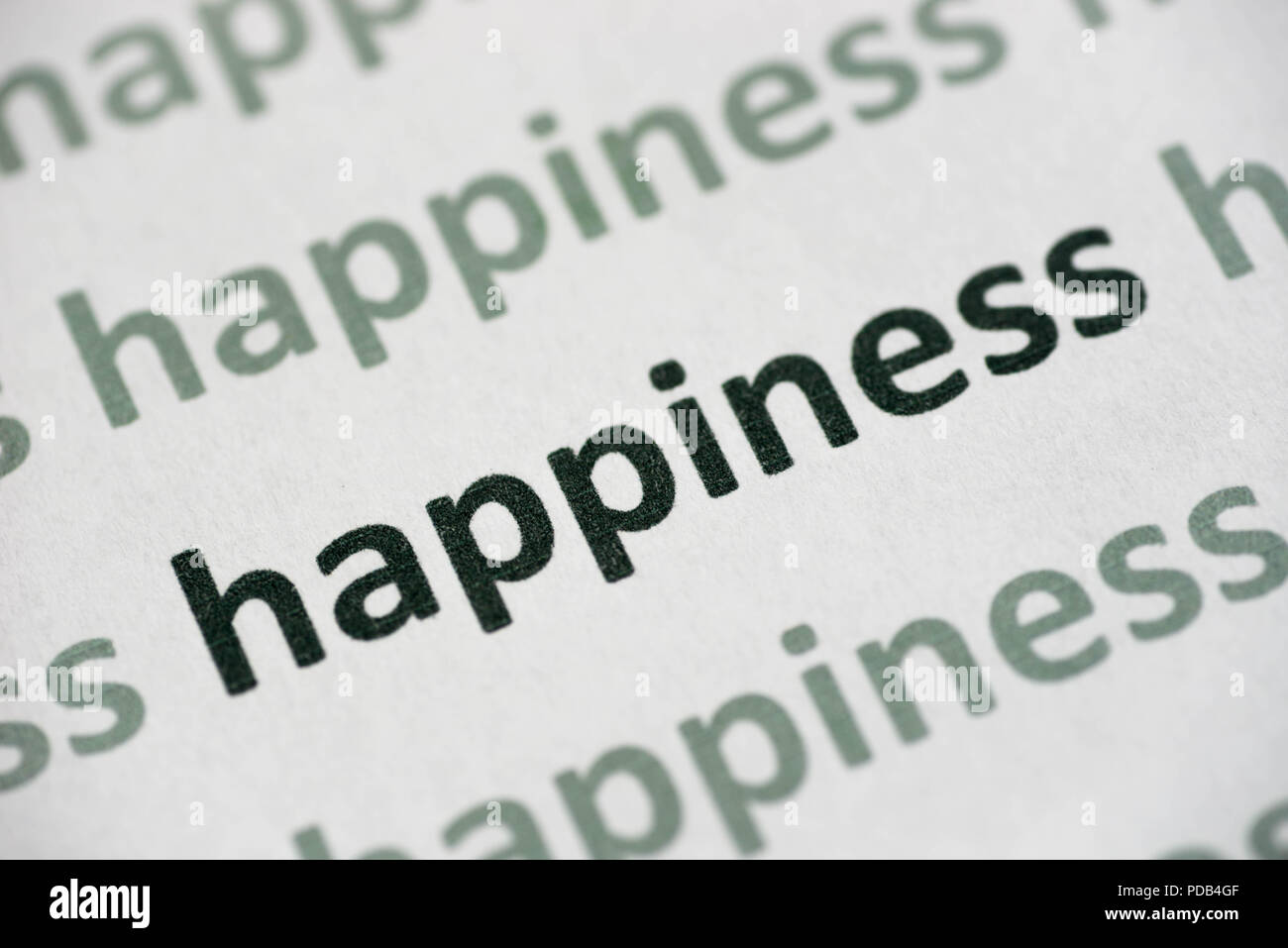 word happiness printed on white paper macro Stock Photo - Alamy
