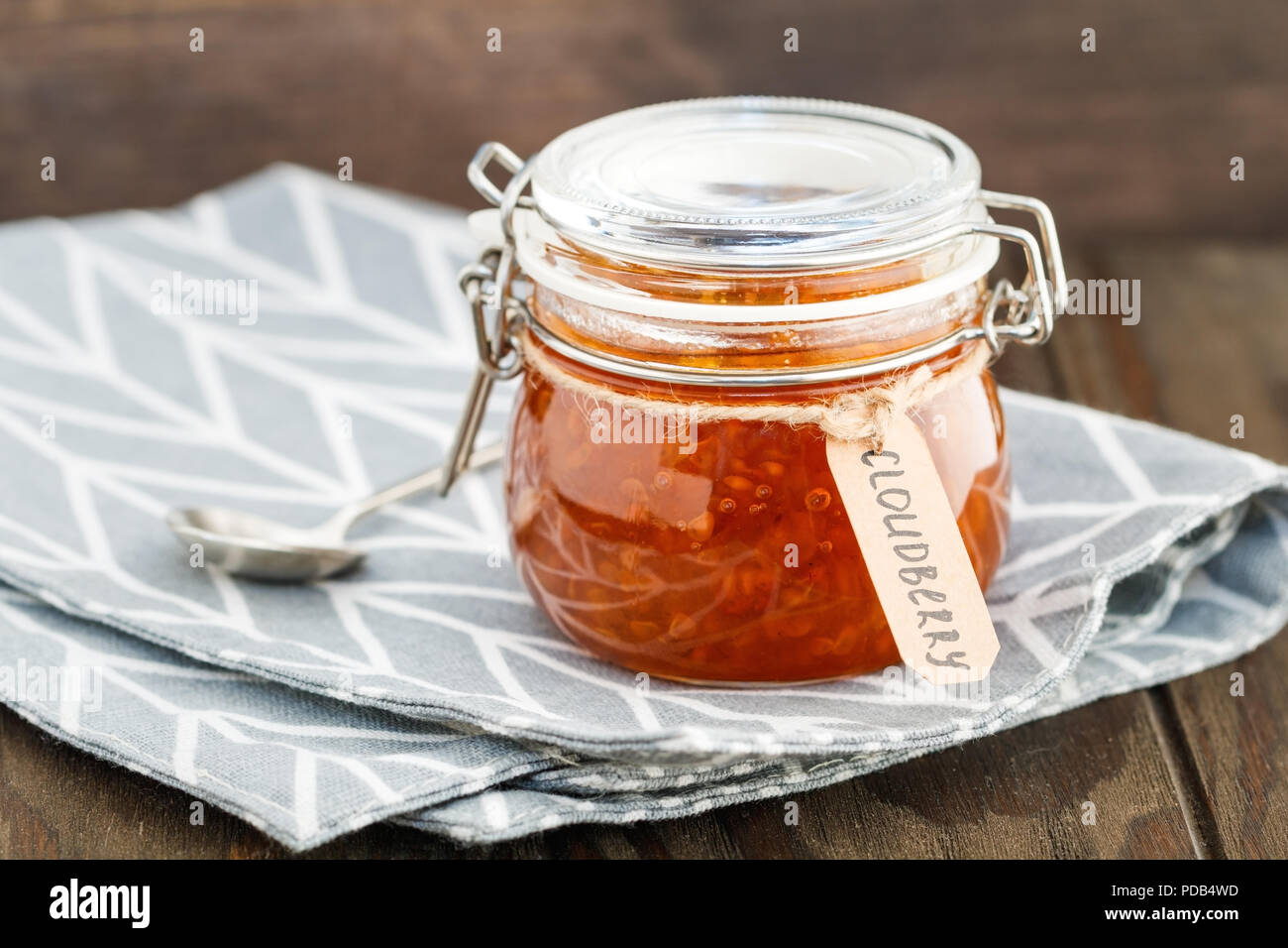Glass jar with cloudberry jam. Nordic cuisine Stock Photo - Alamy