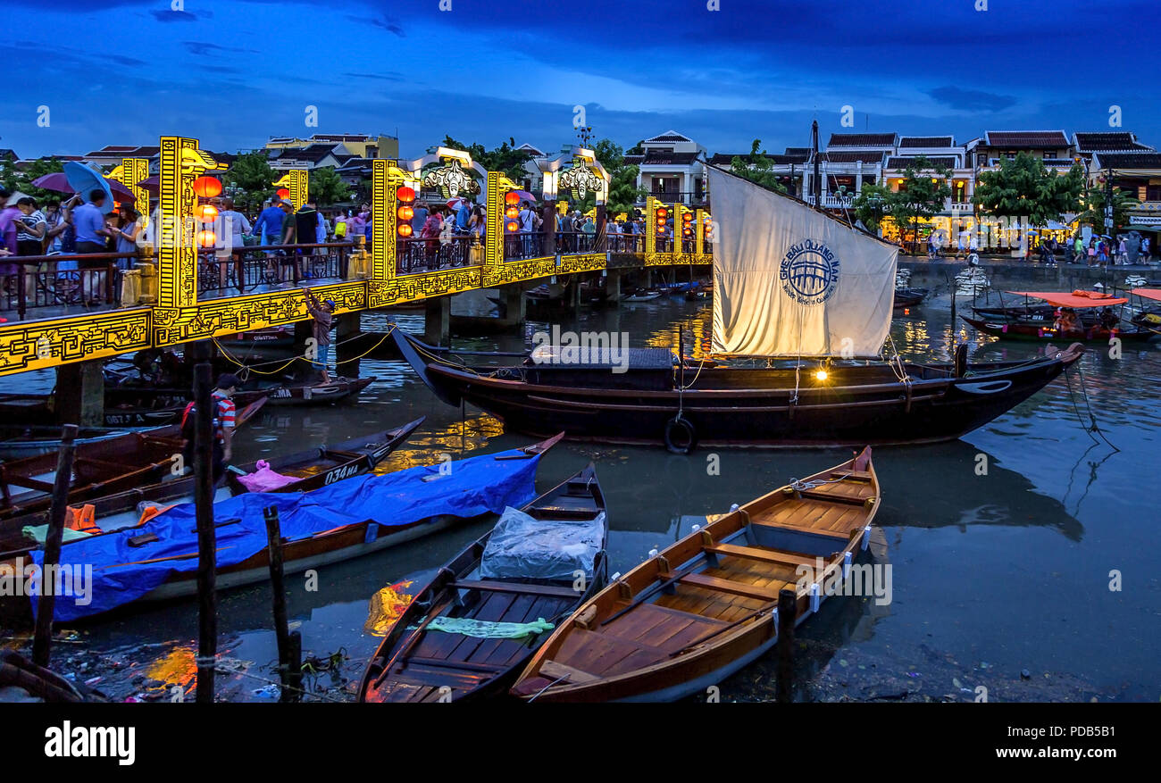 Hoi An Ancient City bridge at night with many boats and lights ...