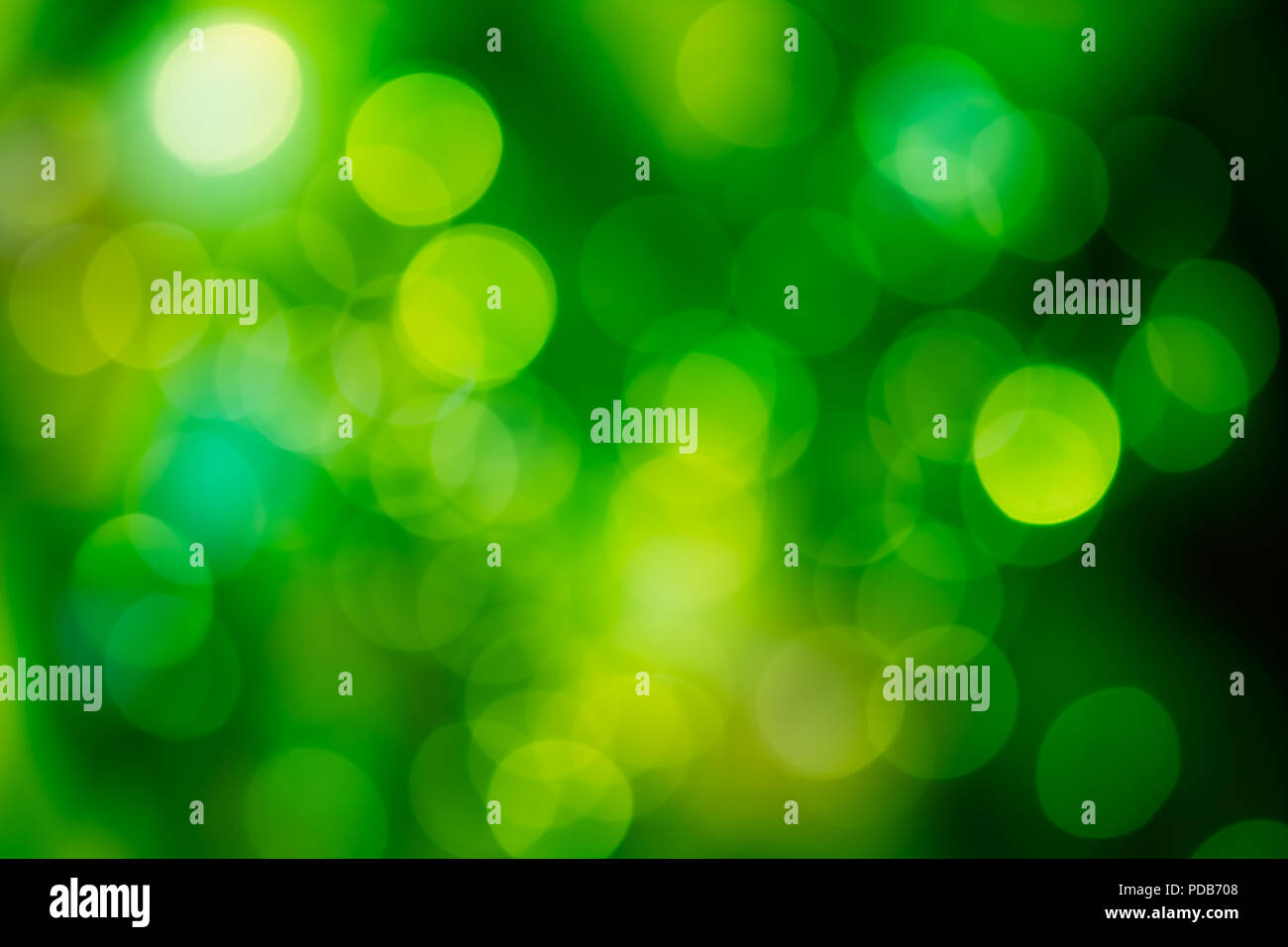 Bright round bokeh on vivid green emerald color background Stock Photo ...