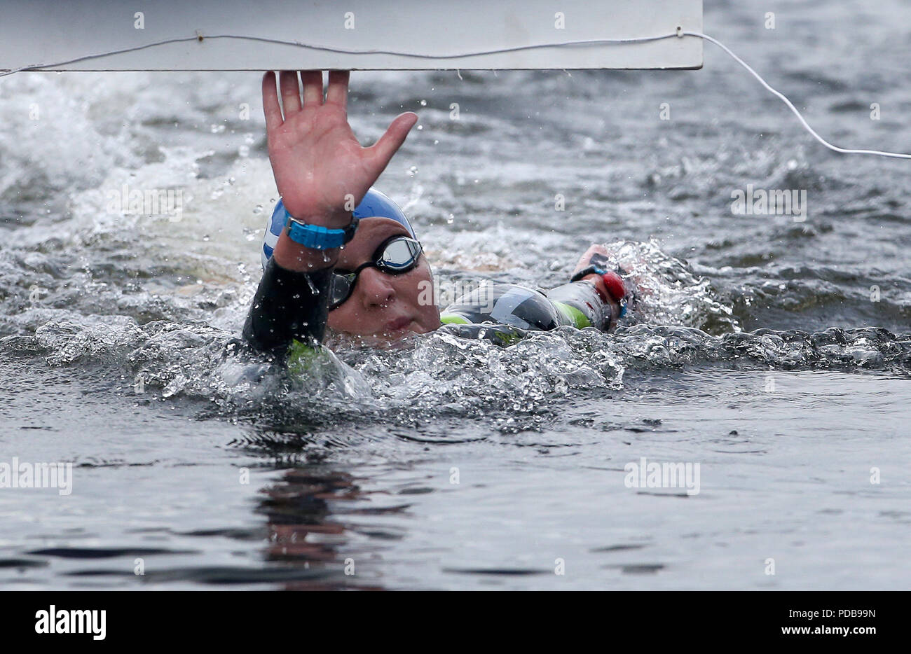 Great Britain's Polly Holden touches the finish board in the Women's 5km Open Water during day ...