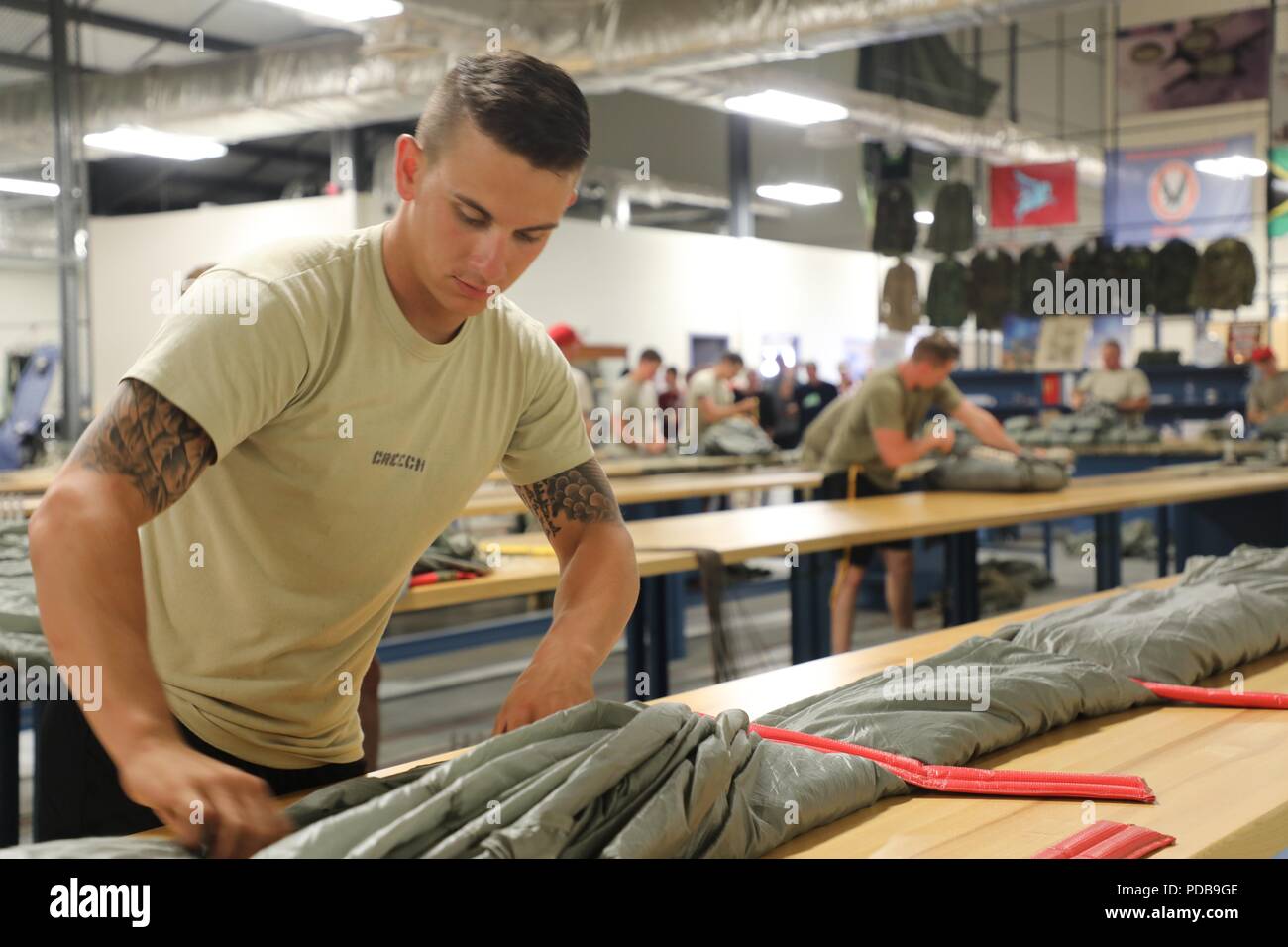 U.S. Army Spc. Joshua Creech, assigned to 338th Quartermaster, repack ...