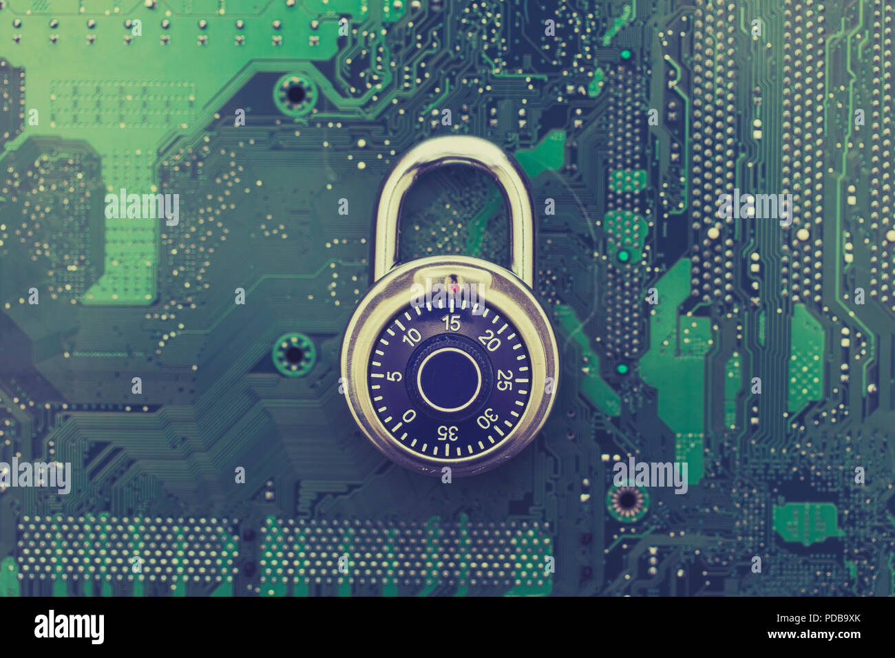 Padlock on a computer electronic circuit board. Data technology ...