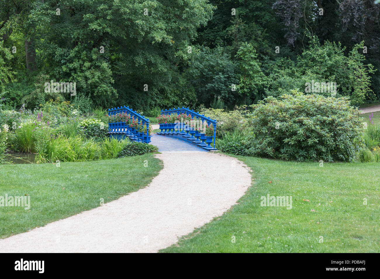 old blue bridge in the Fuerst Pueckler park in Bad Muskau Germany Stock ...