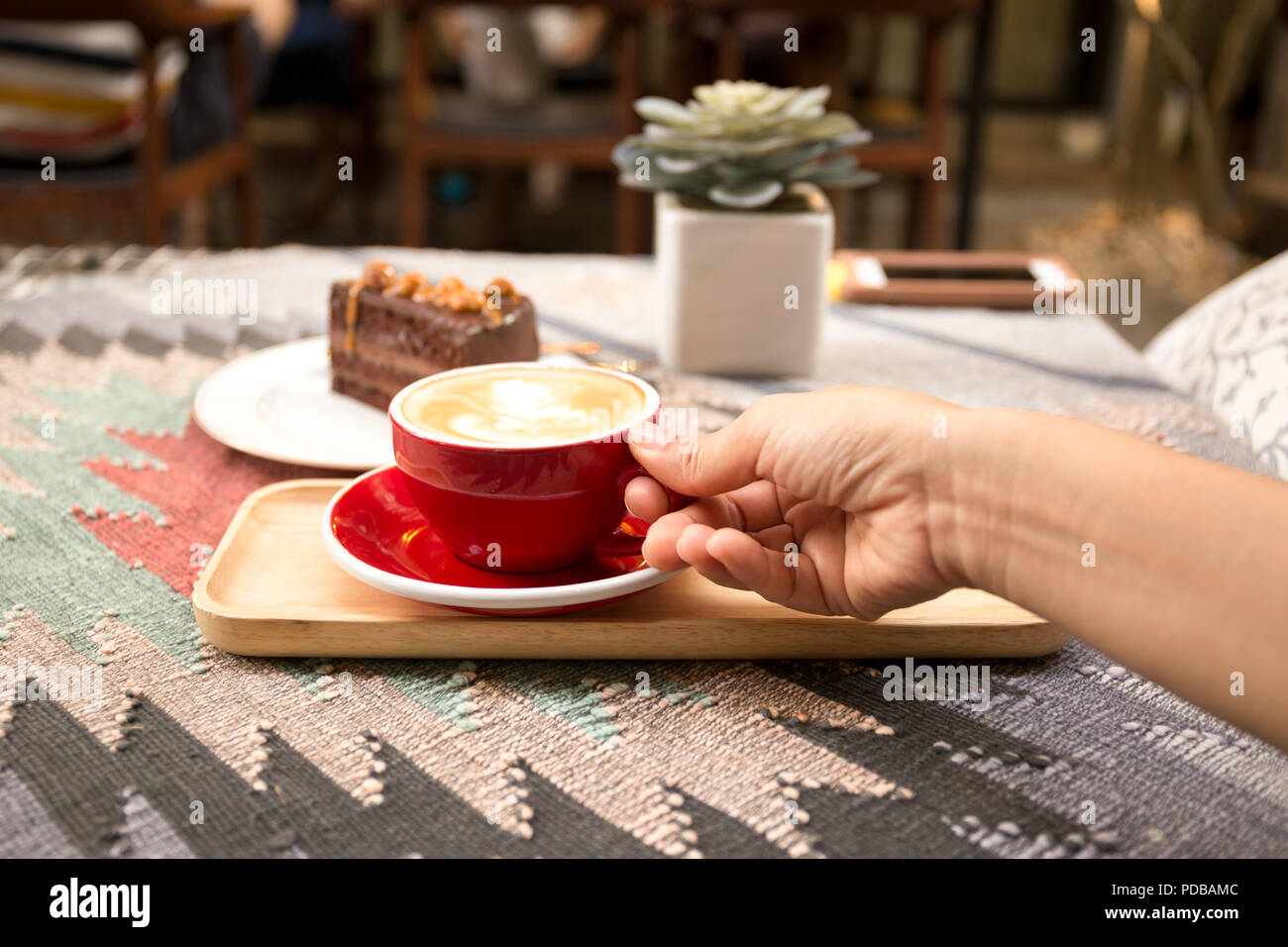 Female hand holding piece chocolate hi-res stock photography and images ...