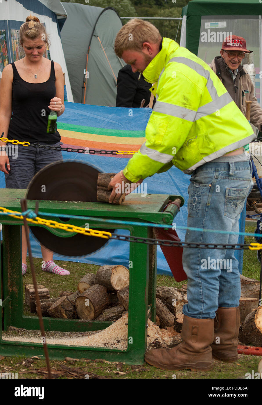 A man using a table saw with no personal protection Stock Photo - Alamy