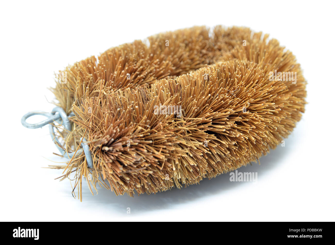 Cleaning brush made from coconut husk on white Stock Photo - Alamy