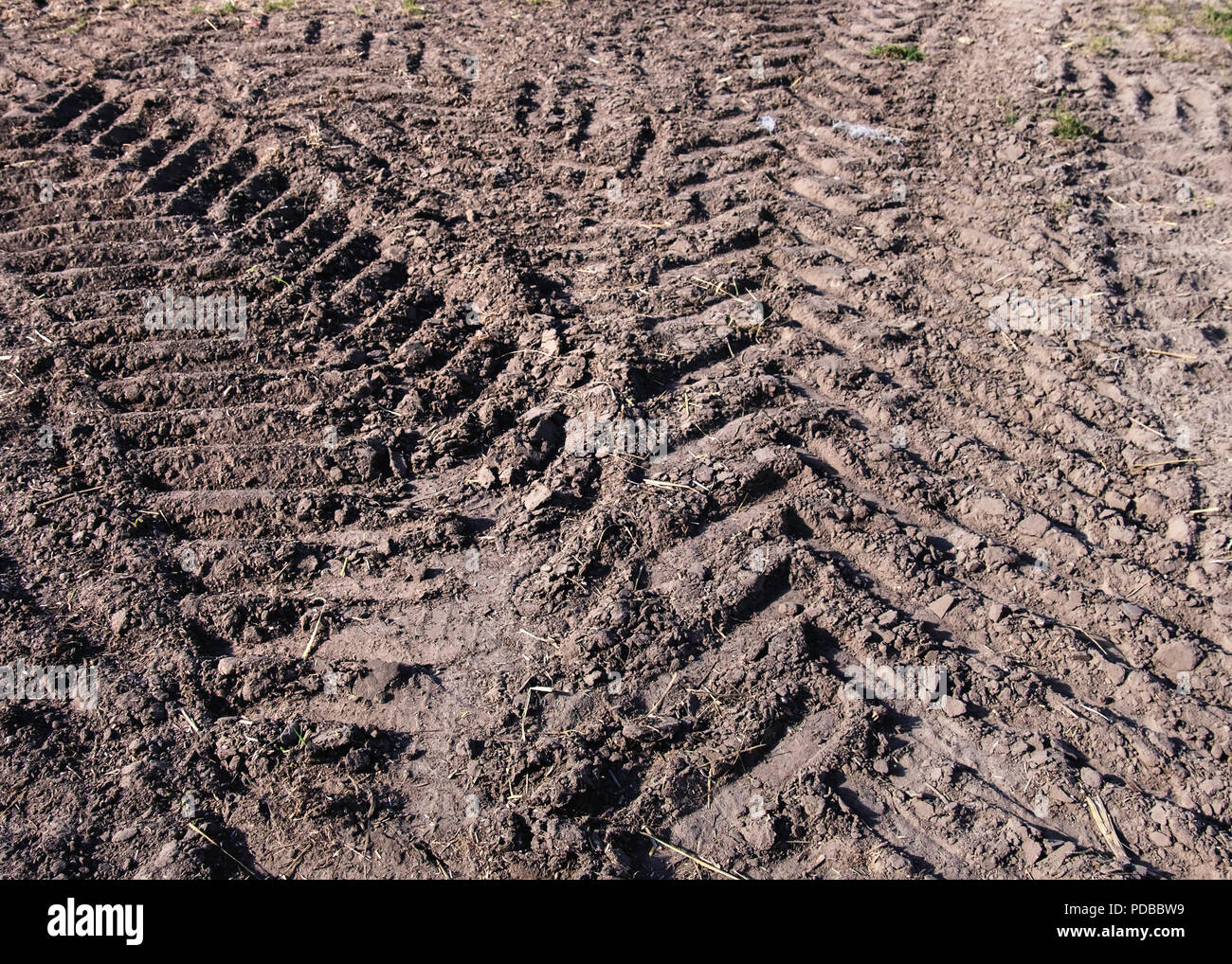 Tyre tracks on dirt road, muddy tyre track, abstract background image ...