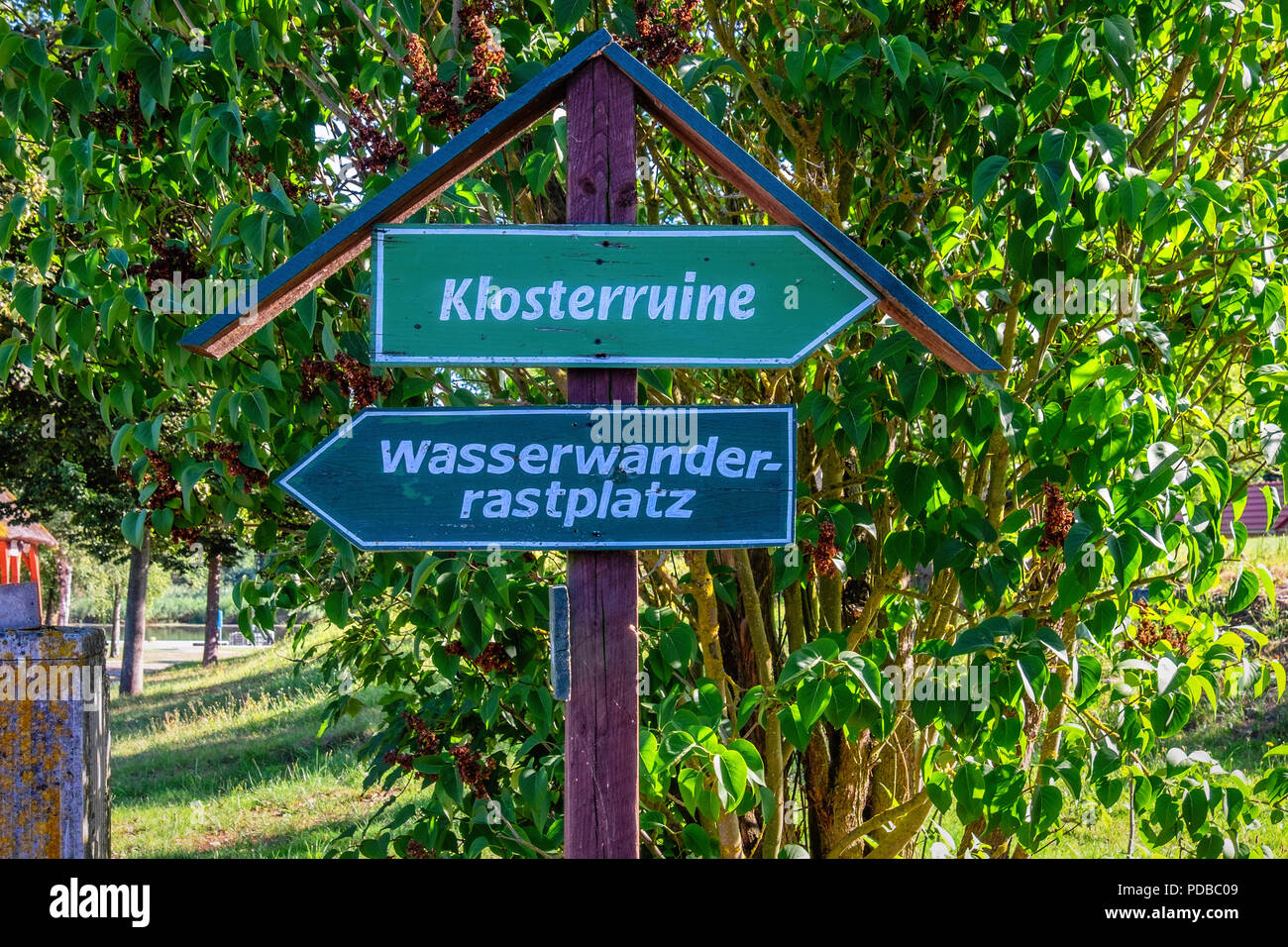 Germany, Stolpe an der Peene, Gutshaus Stolpe Estate. Green road sign ...
