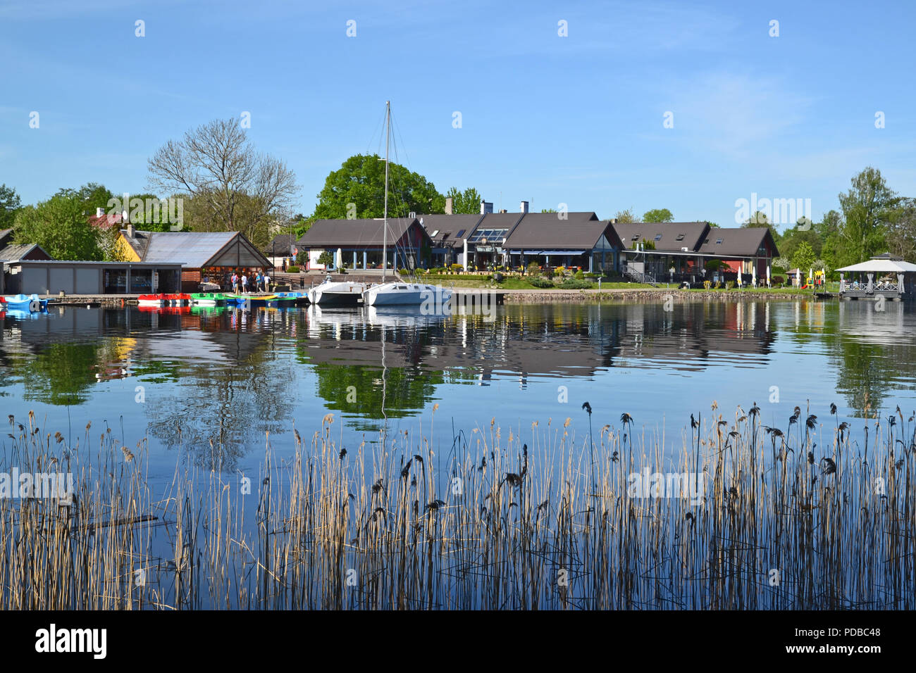 Fisherman houses in front of the lake Stock Photo - Alamy
