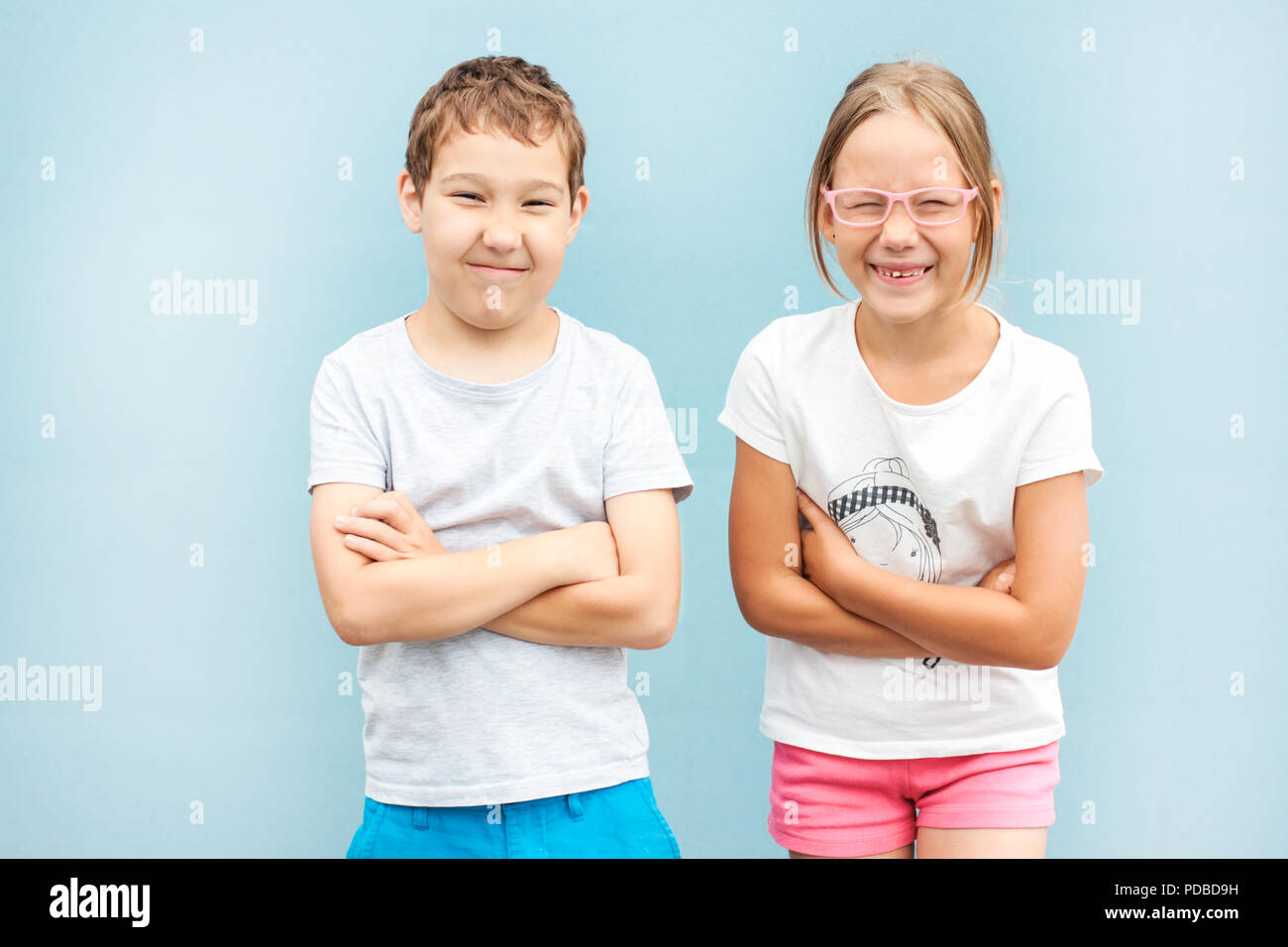 Kids brother and sister twins 8 years old standing with funny faces on ...