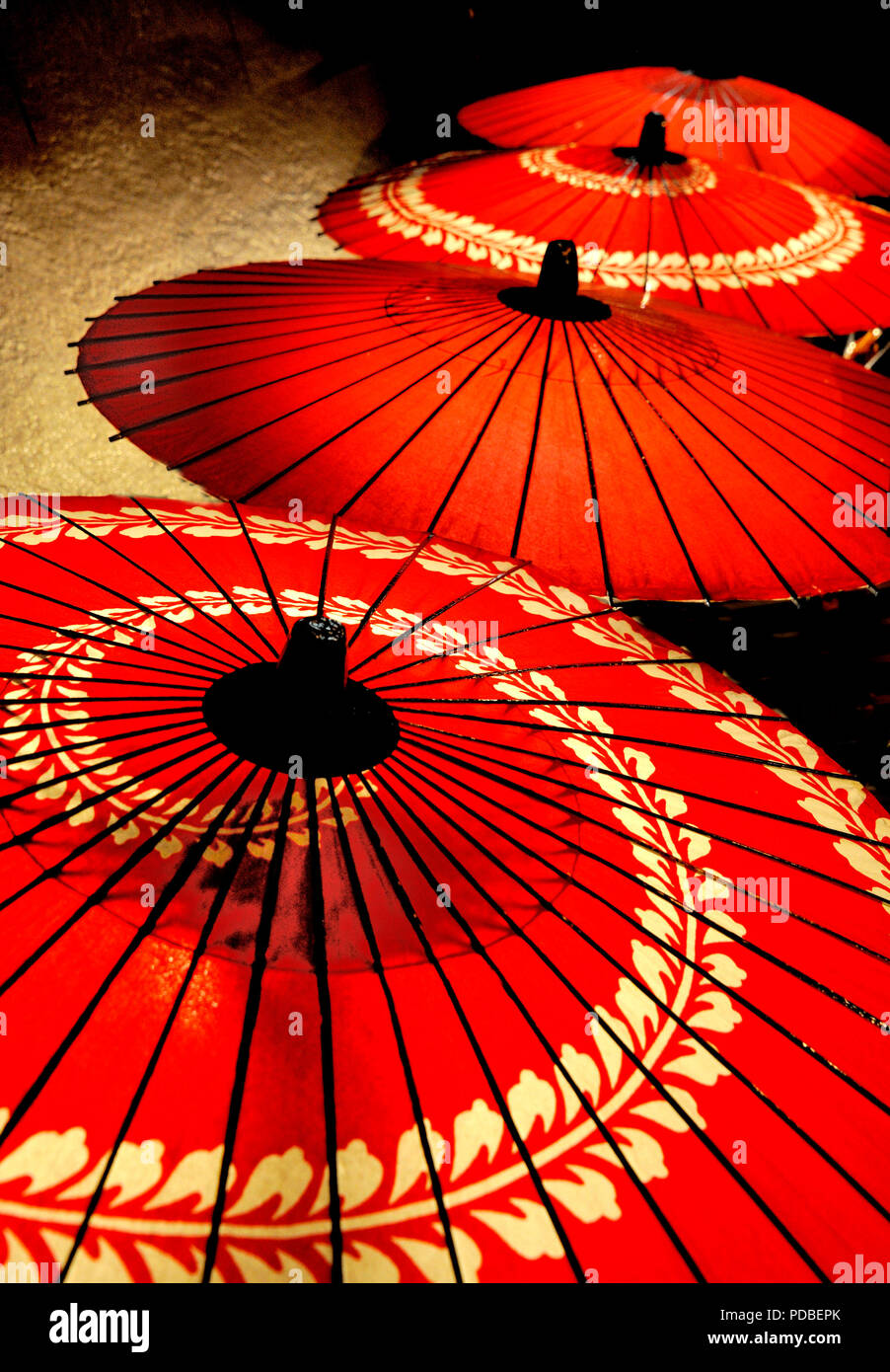 Beautiful red parasols by night in Japan Stock Photo - Alamy