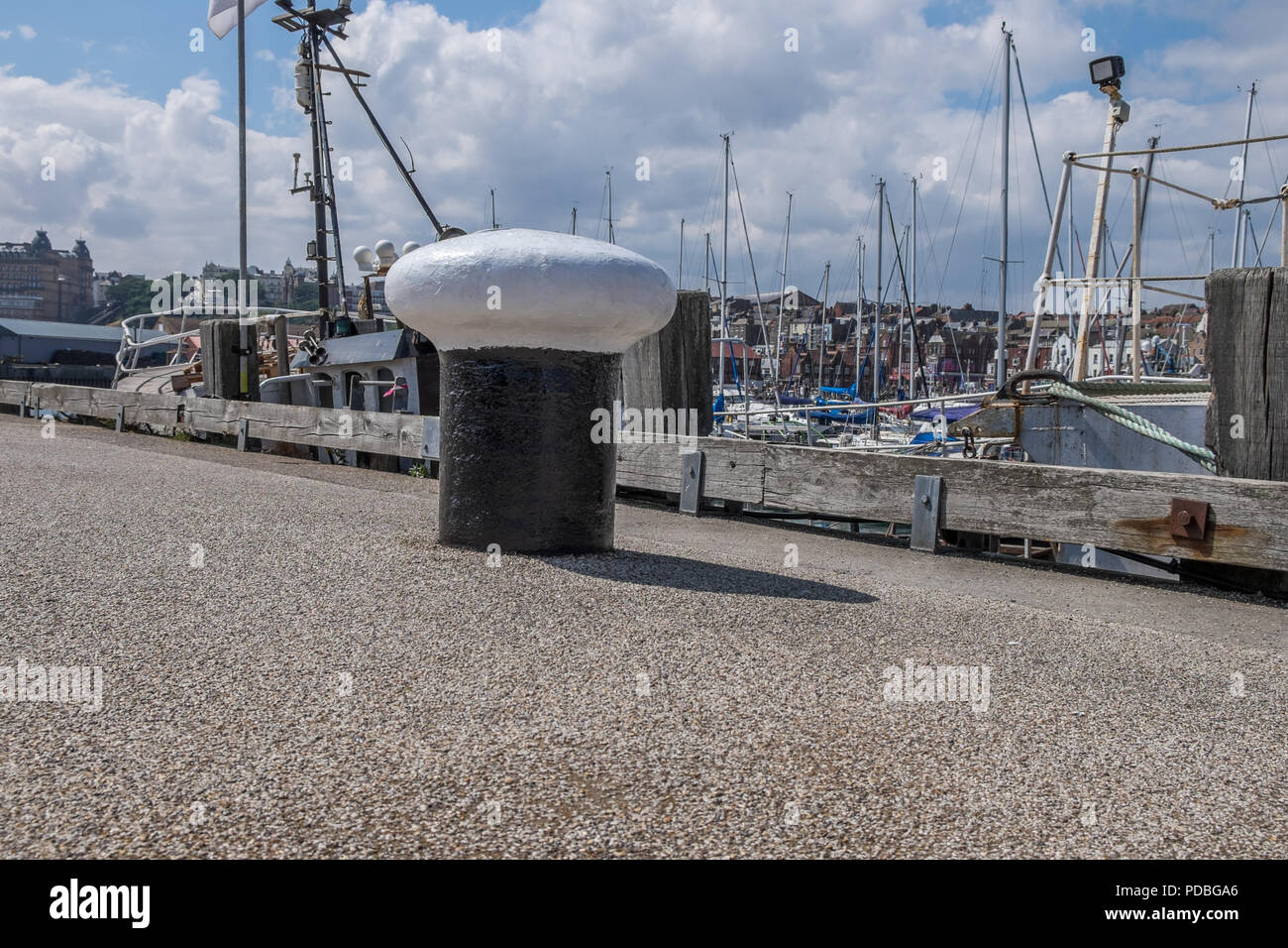 Black and white mooring post on the quay side at Scarborough harbour ...
