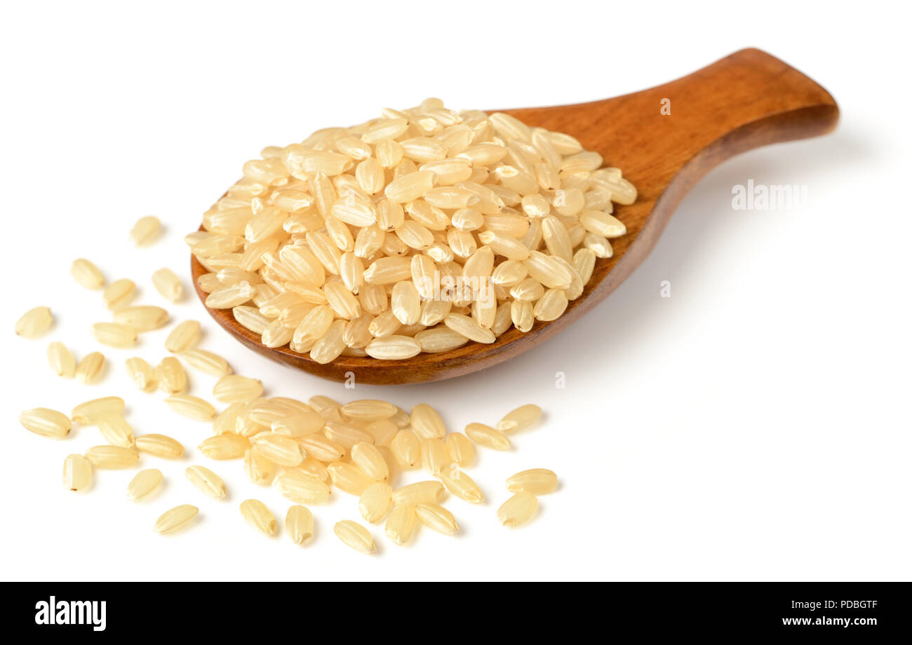 raw brown rice isolated on the white background Stock Photo - Alamy
