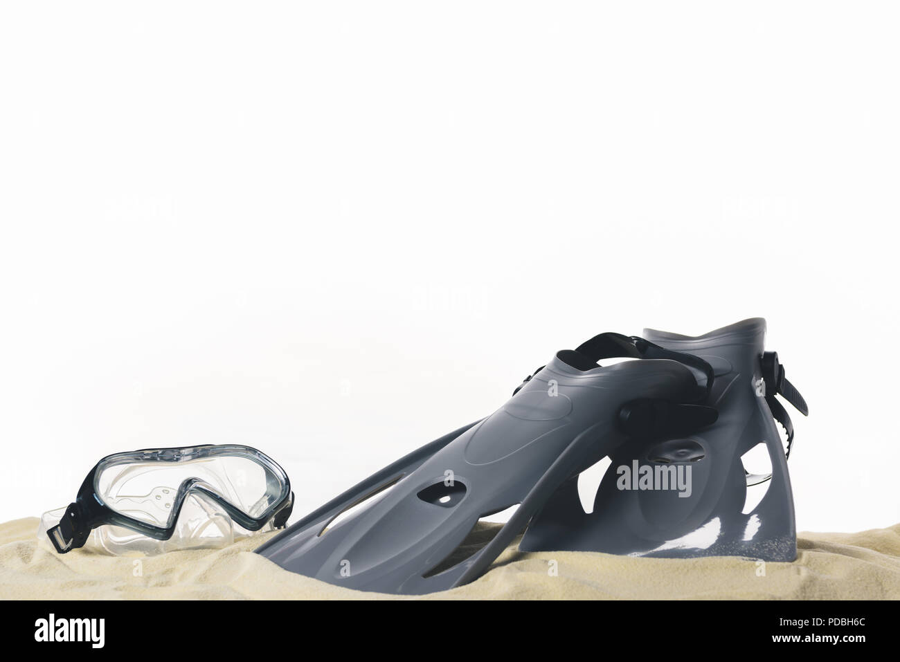 Mask and flippers in sand isolated on white Stock Photo - Alamy