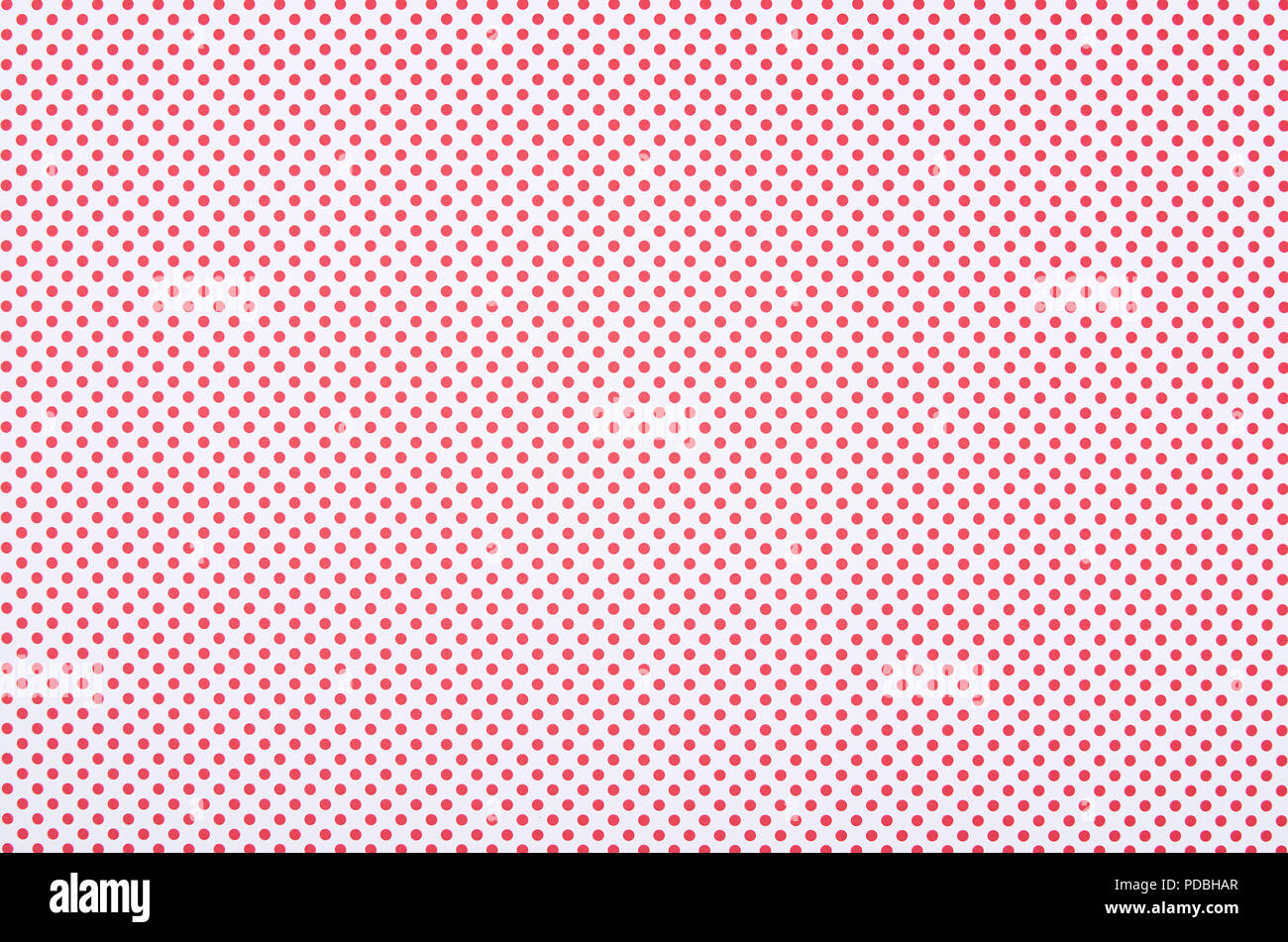 Red polka dot pattern on white background Stock Photo - Alamy