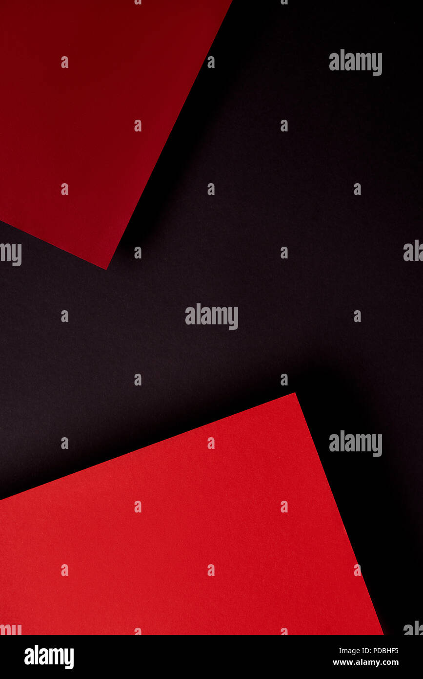 Paper sheets in red and black tones background Stock Photo - Alamy