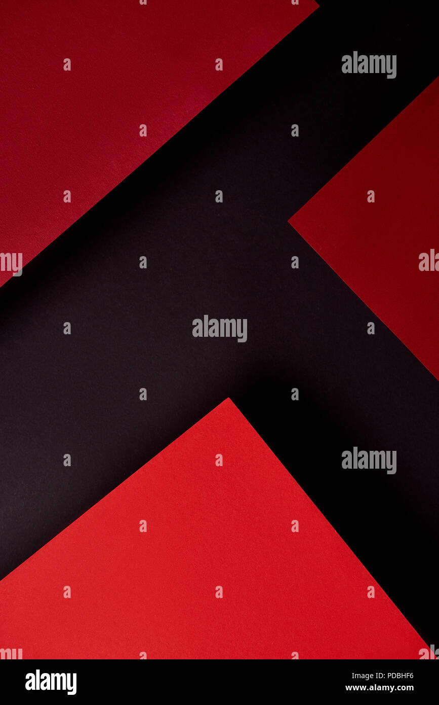 Abstract background with red paper sheets on black Stock Photo - Alamy