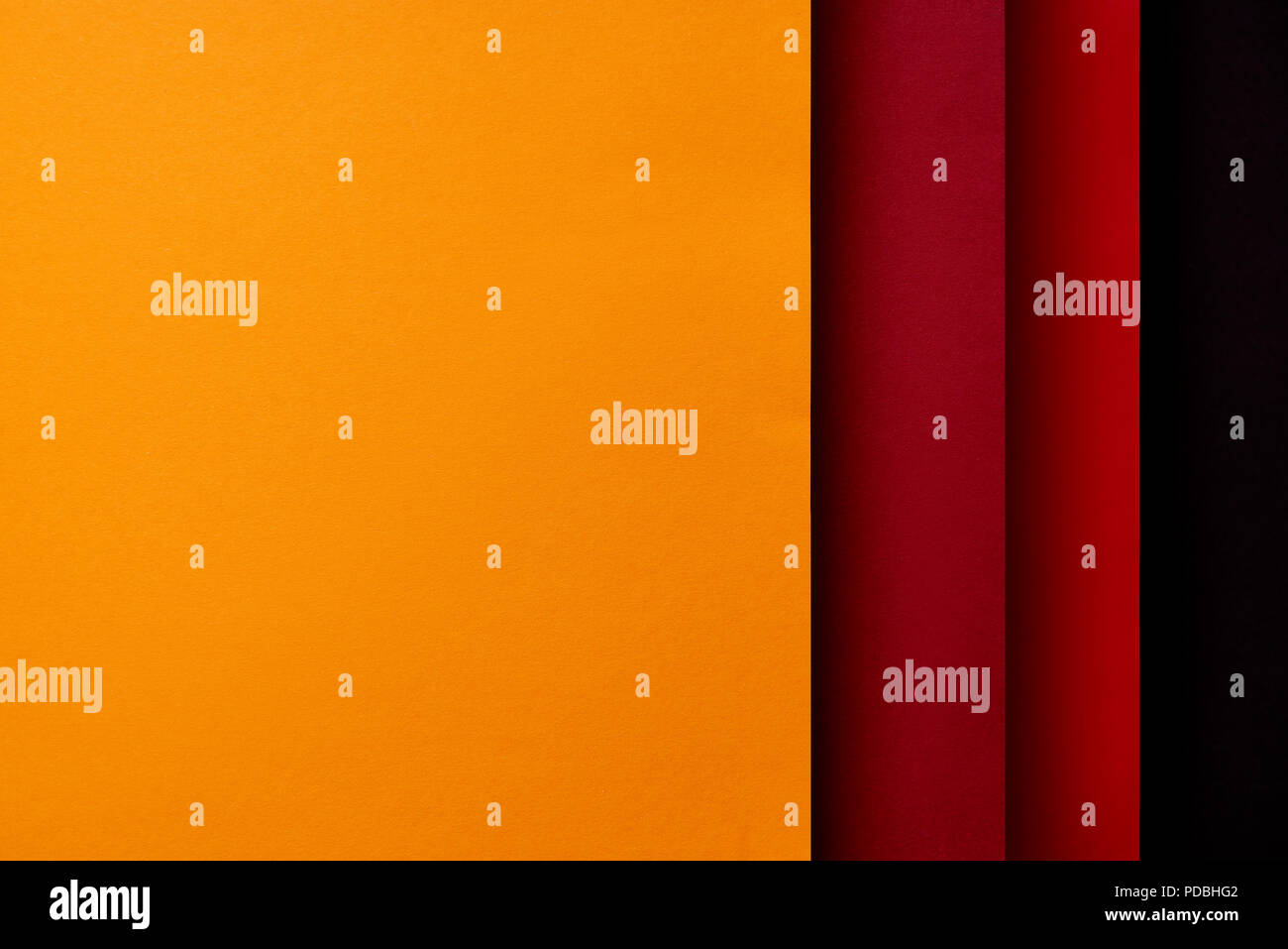 Paper sheets in red and yellow tones background Stock Photo - Alamy