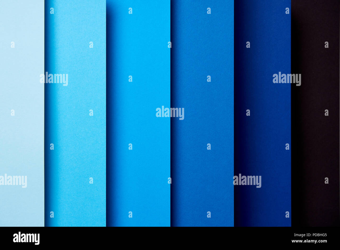 Pattern of overlapping paper sheets in blue tones Stock Photo - Alamy