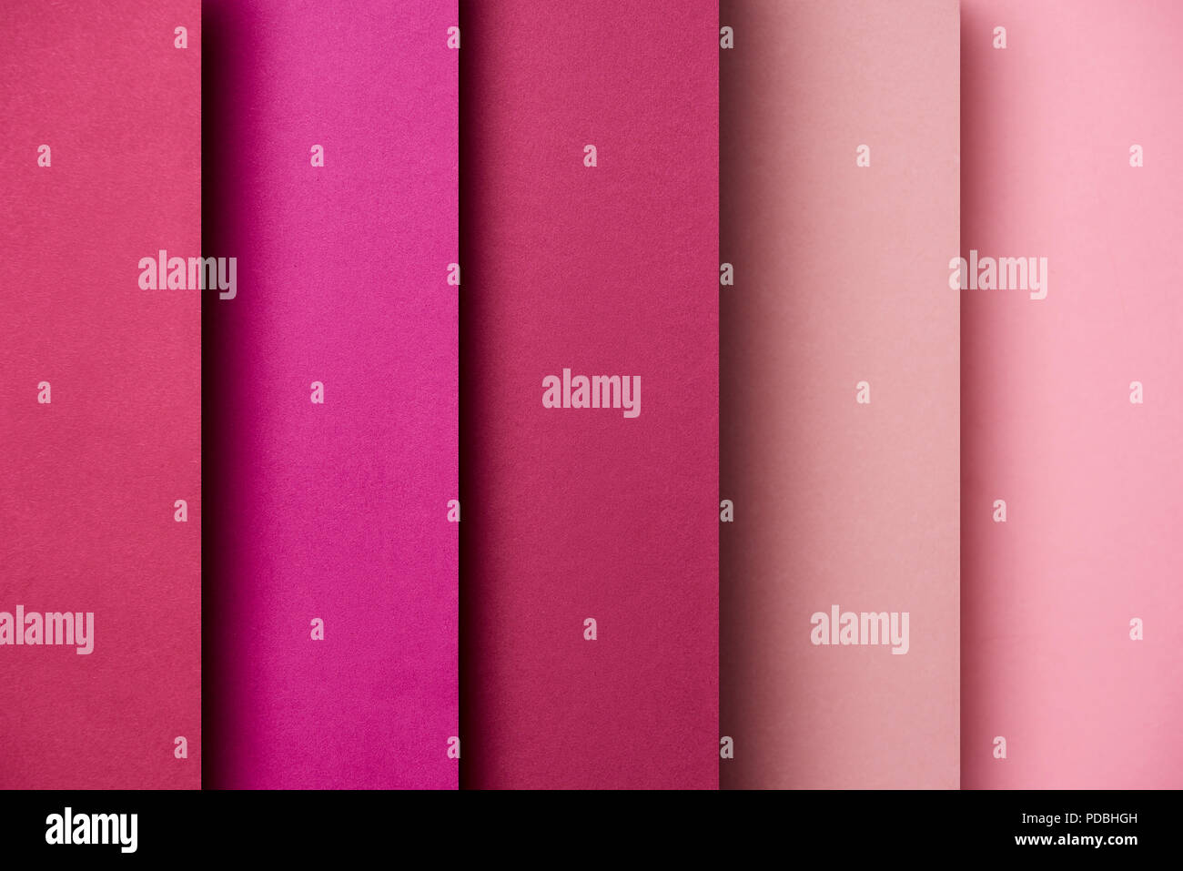 Pattern of overlapping paper sheets in pink and magenta tones Stock ...
