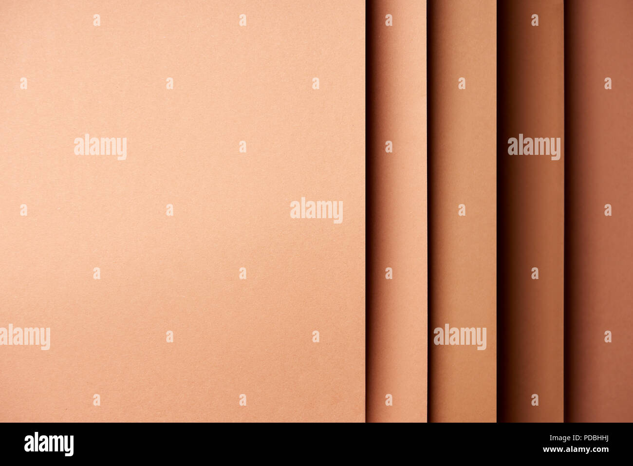 Paper sheets in brown tones background Stock Photo - Alamy