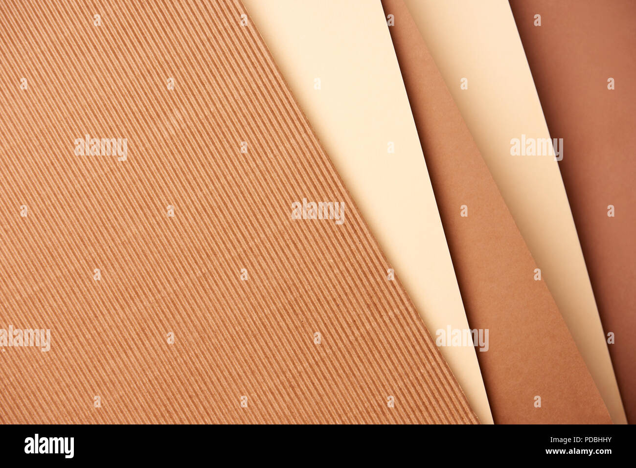 Pattern of diagonal paper sheets in beige and brown tones Stock Photo ...
