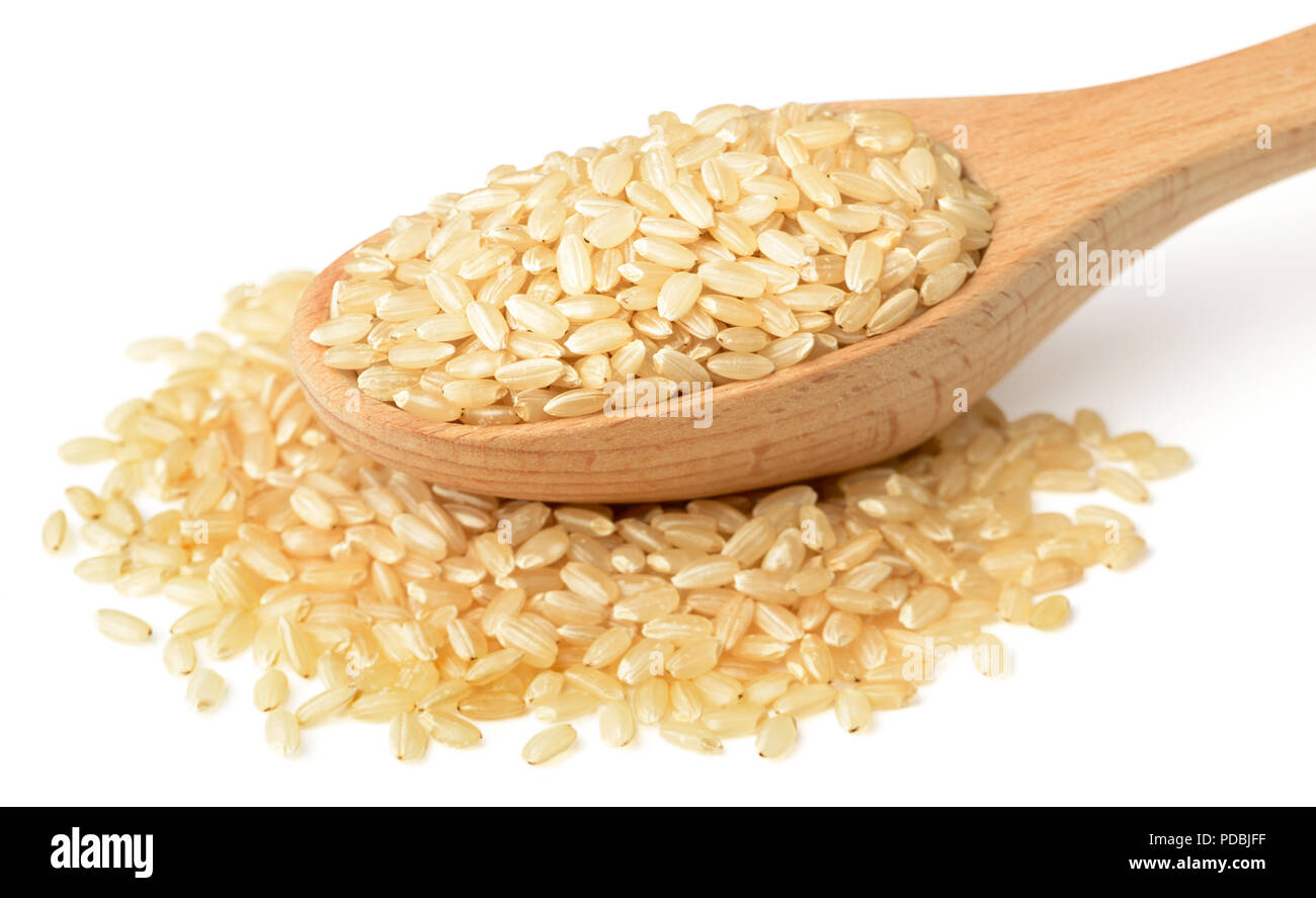 raw brown rice isolated on the white background Stock Photo - Alamy