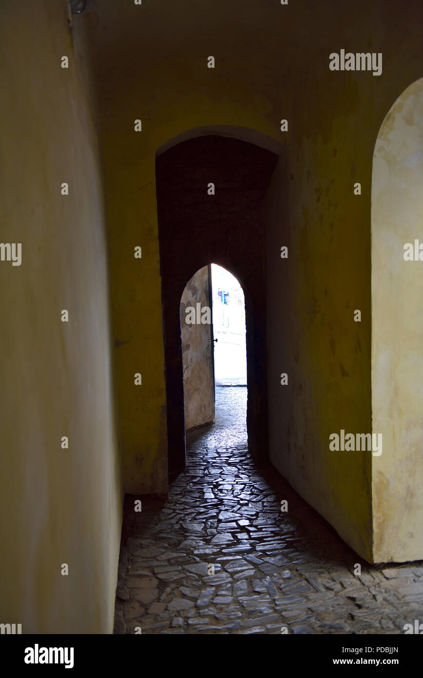 Arched narrow walkway Stock Photo - Alamy
