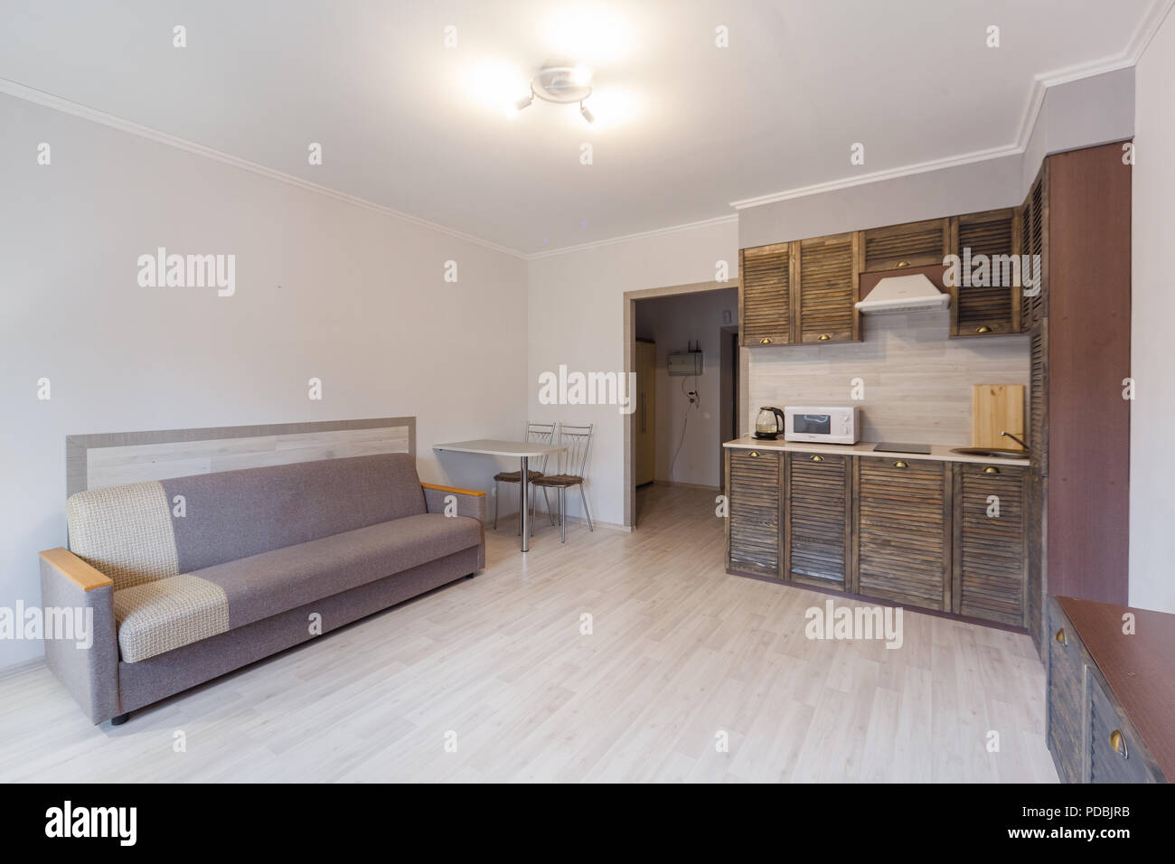 Small and light studio apartment interior Stock Photo - Alamy