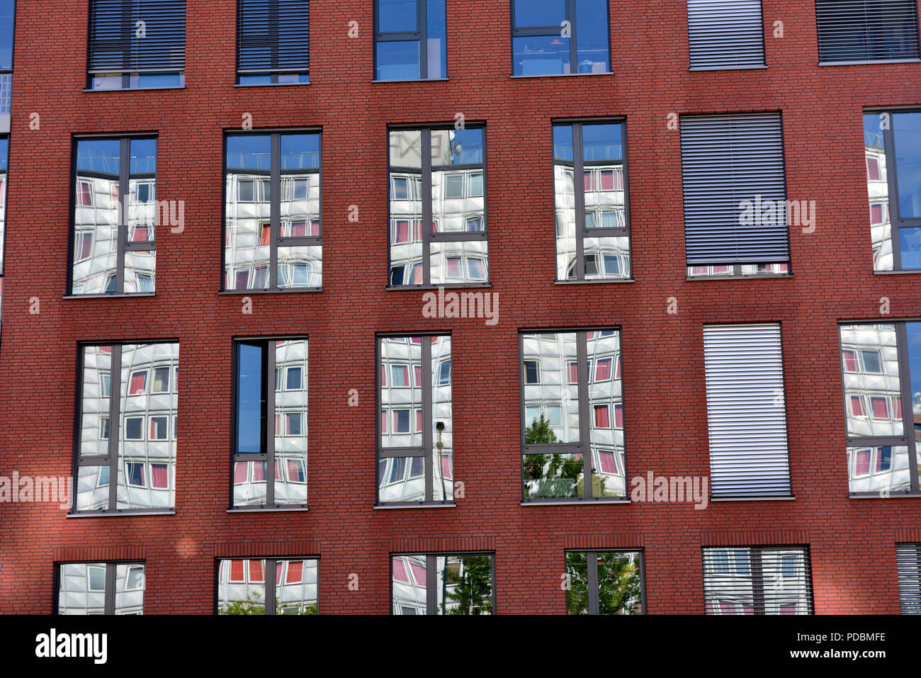 Abstract of building reflected in the windows of adjacent building ...