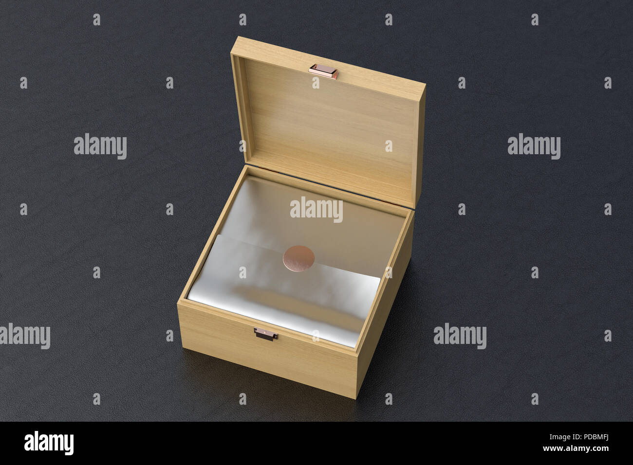 Open wooden small chest or casket with foil on black background ...