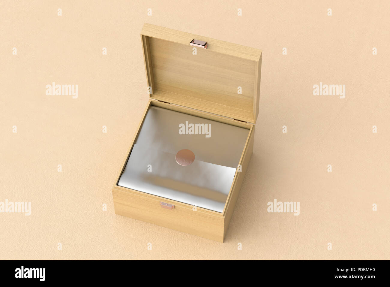 Open wooden small chest or casket with foil on beige leather background ...
