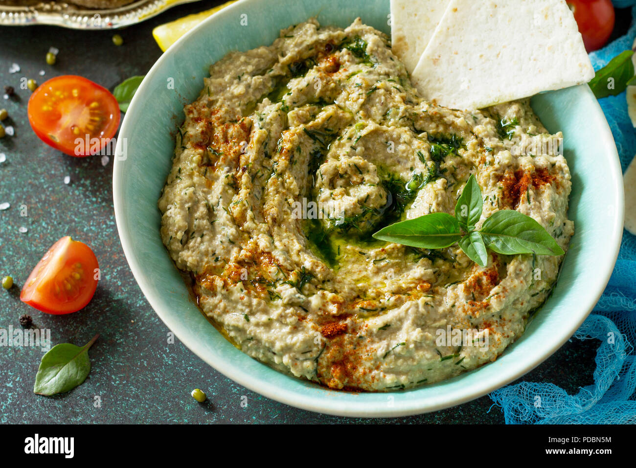 Arabic cuisine. Fresh homemade creamy mung hummus close-up on a stone ...