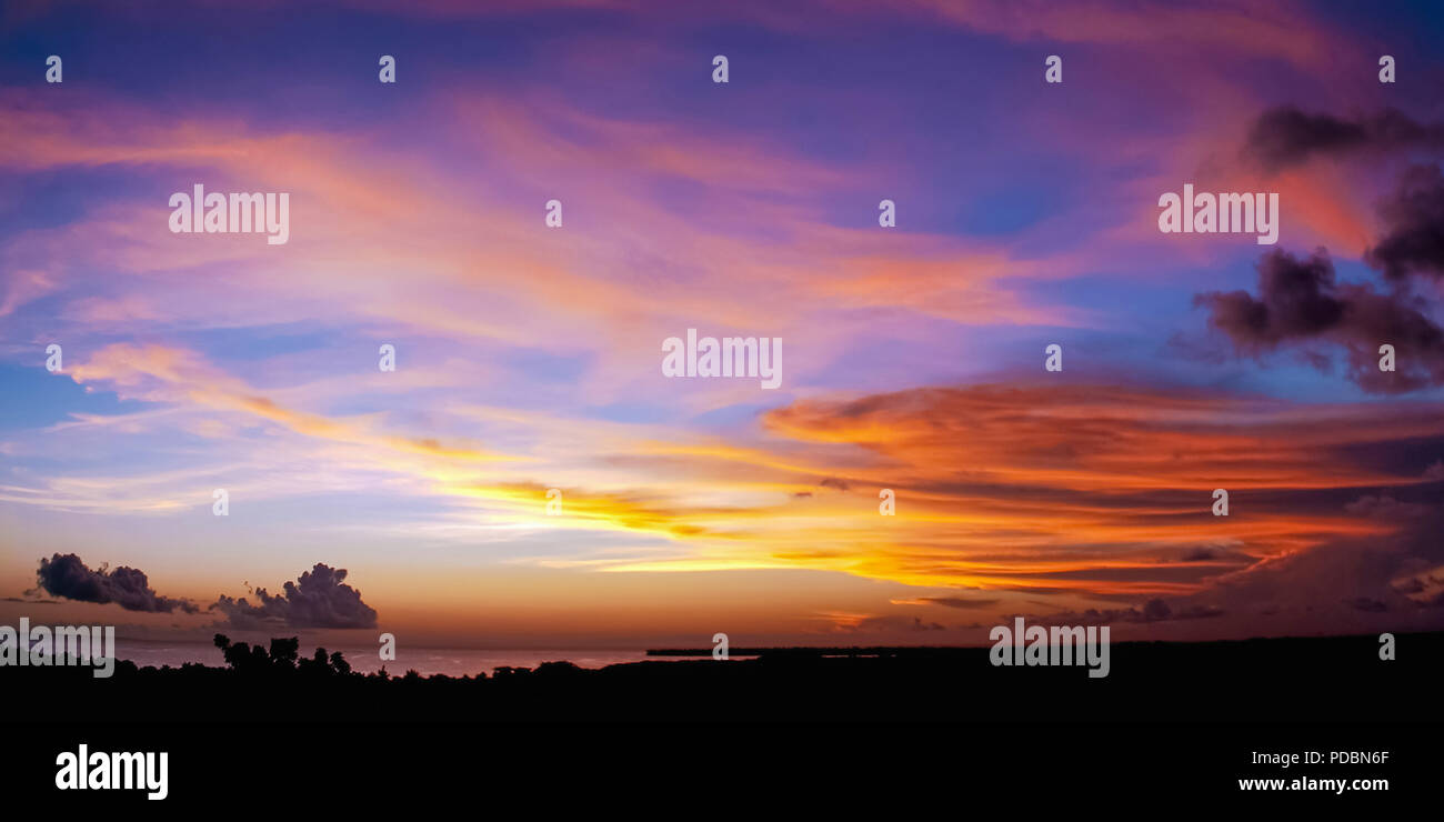 Sunset scene colorful clouds and sky dusk time in Tobago sea on the far ...
