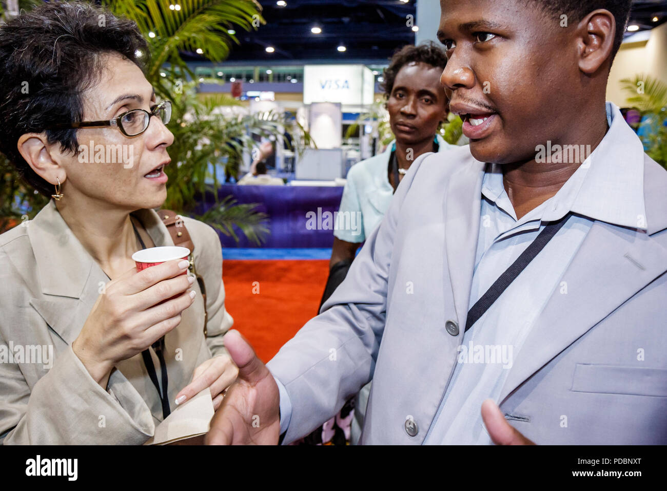 Minority handshake hi-res stock photography and images - Alamy