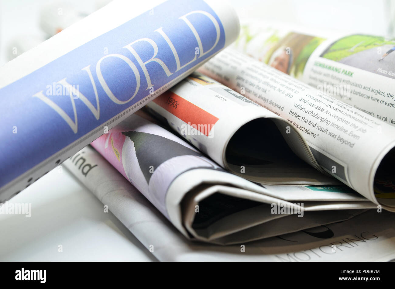 Rolled up local newspaper hi-res stock photography and images - Alamy
