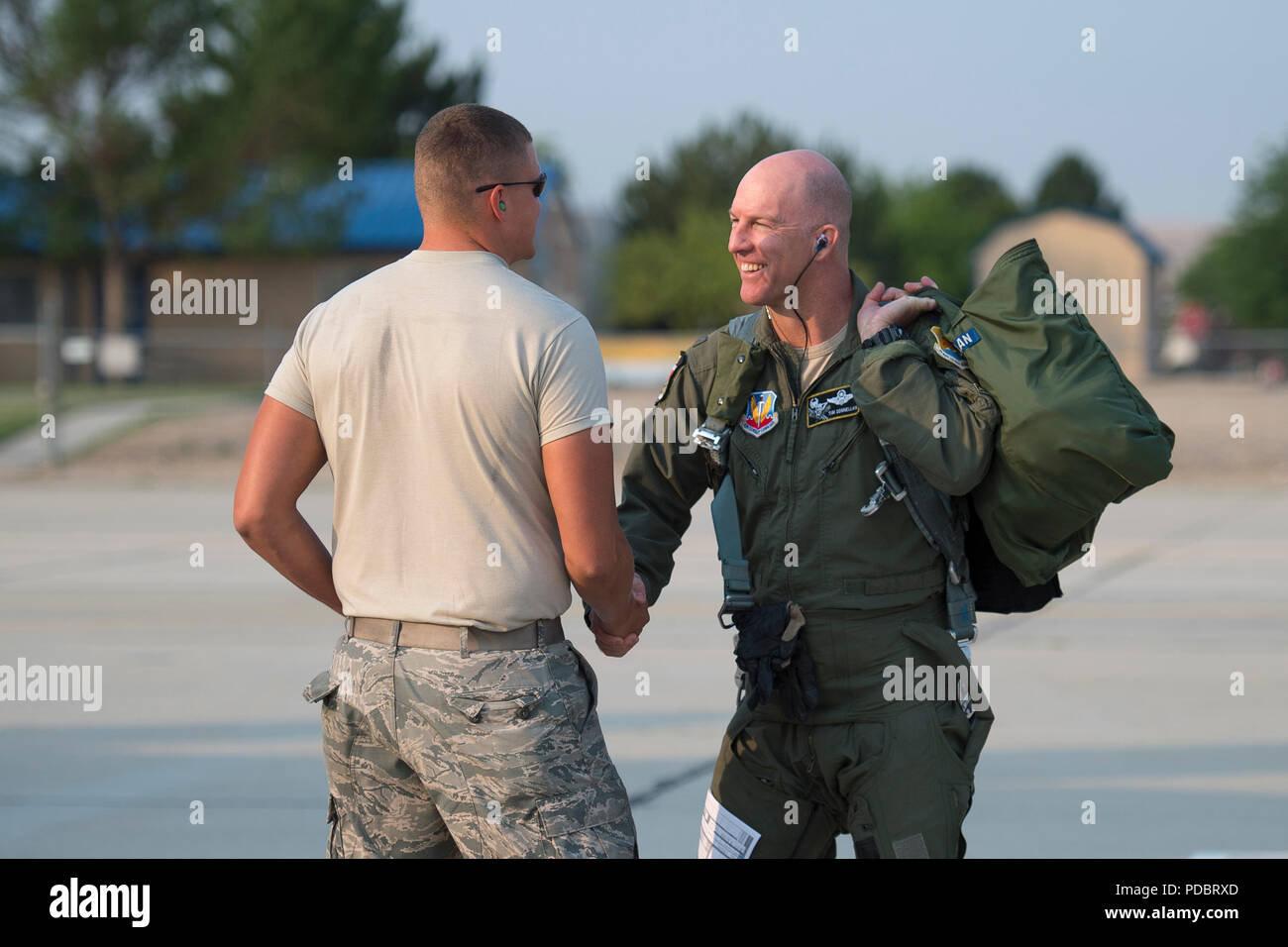 Col. Tim Donnellan, the 124th Fighter Wing commander, greets Airman 1st ...