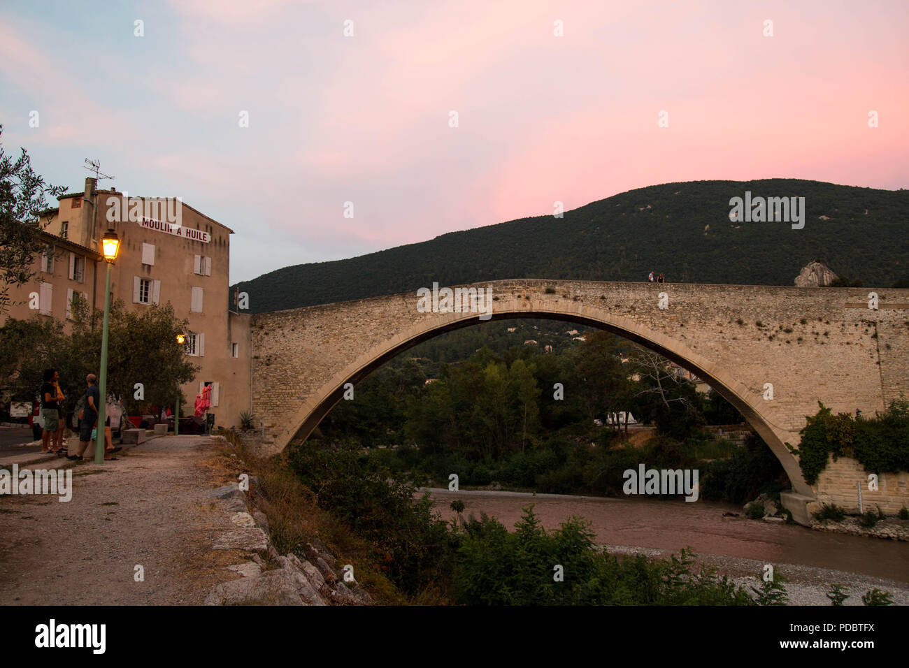 Pont de Nyons at sunset. This medieval bridge is located in Provence ...