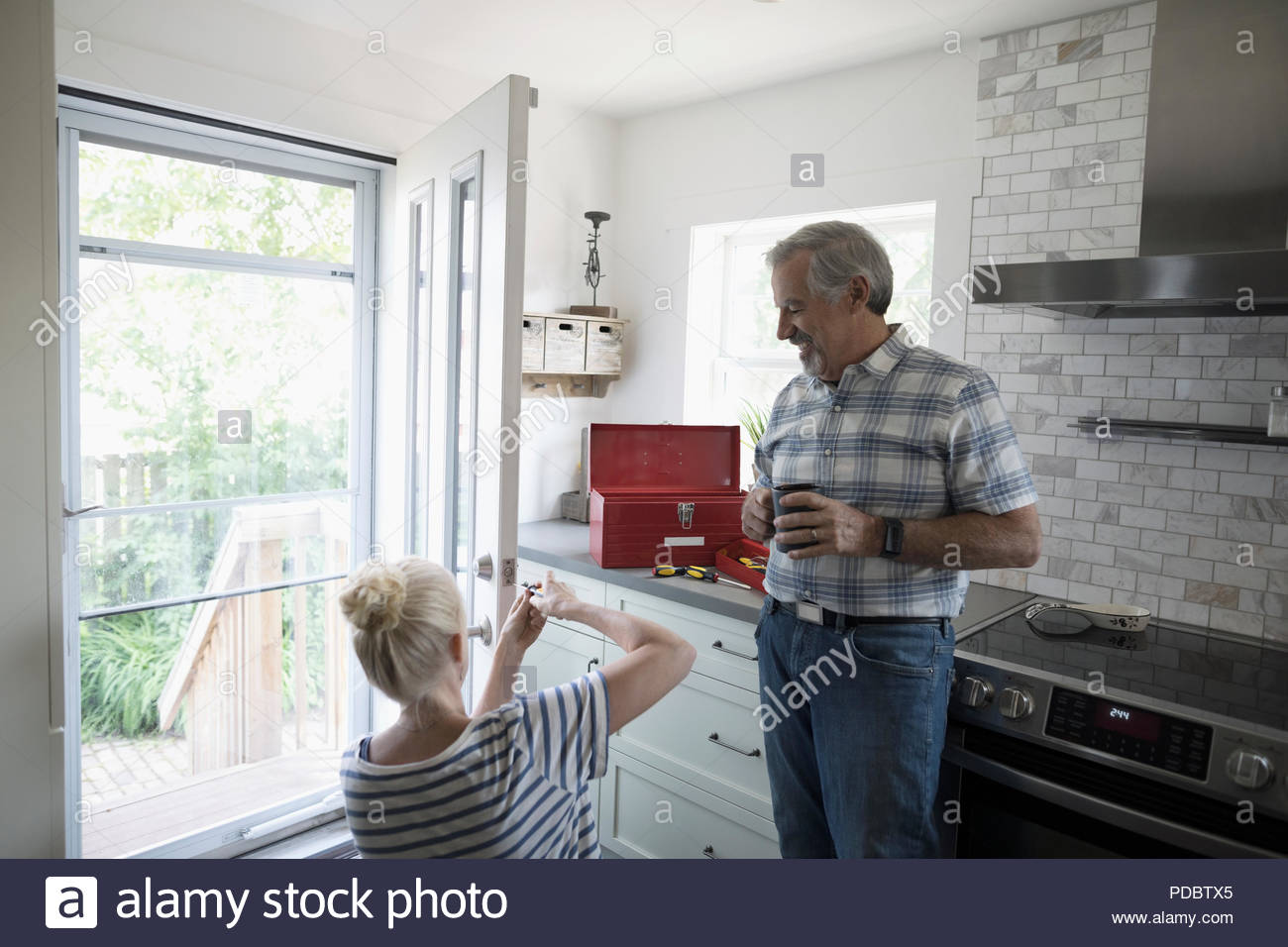 Woman door lock hi-res stock photography and images - Alamy