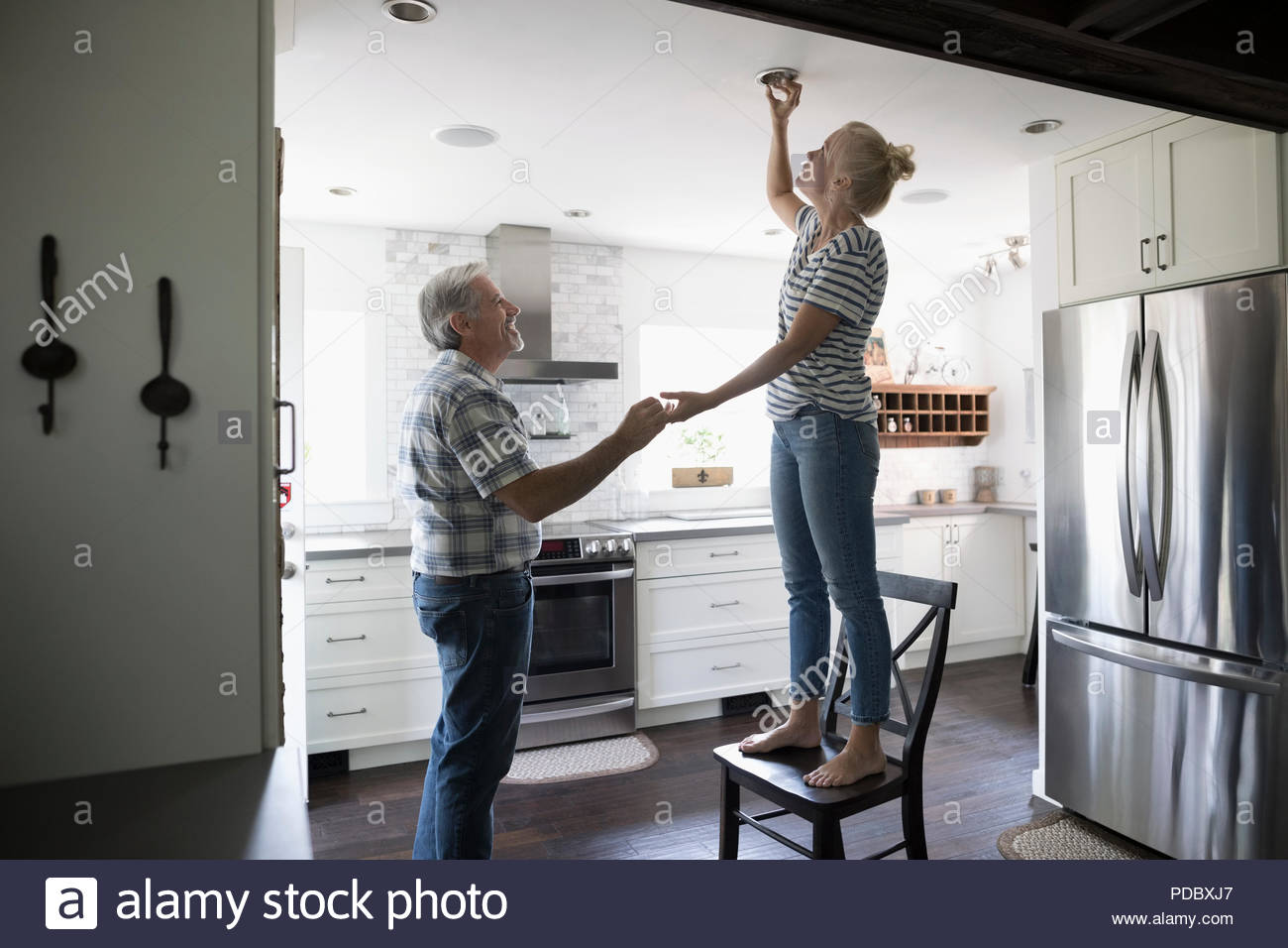 Light bulb change man chair hi-res stock photography and images - Alamy