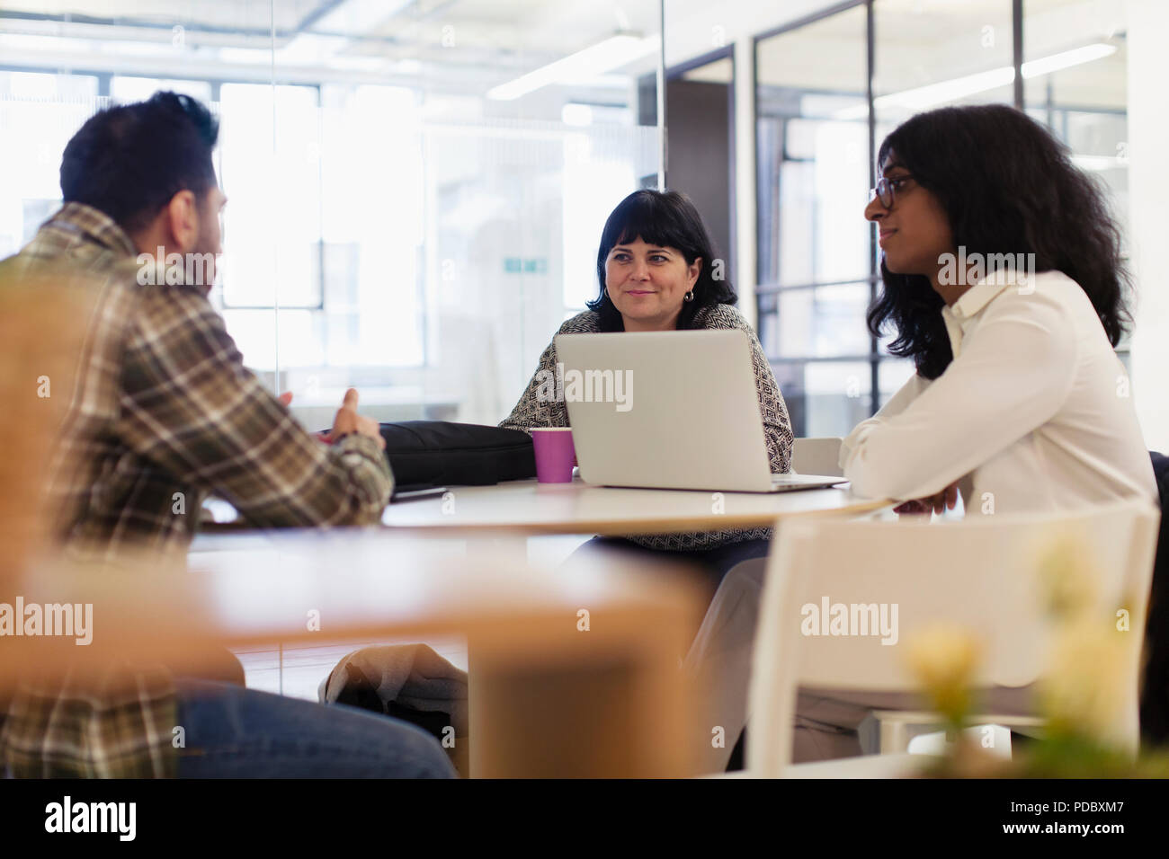 Business people with laptop talking in office meeting Stock Photo - Alamy