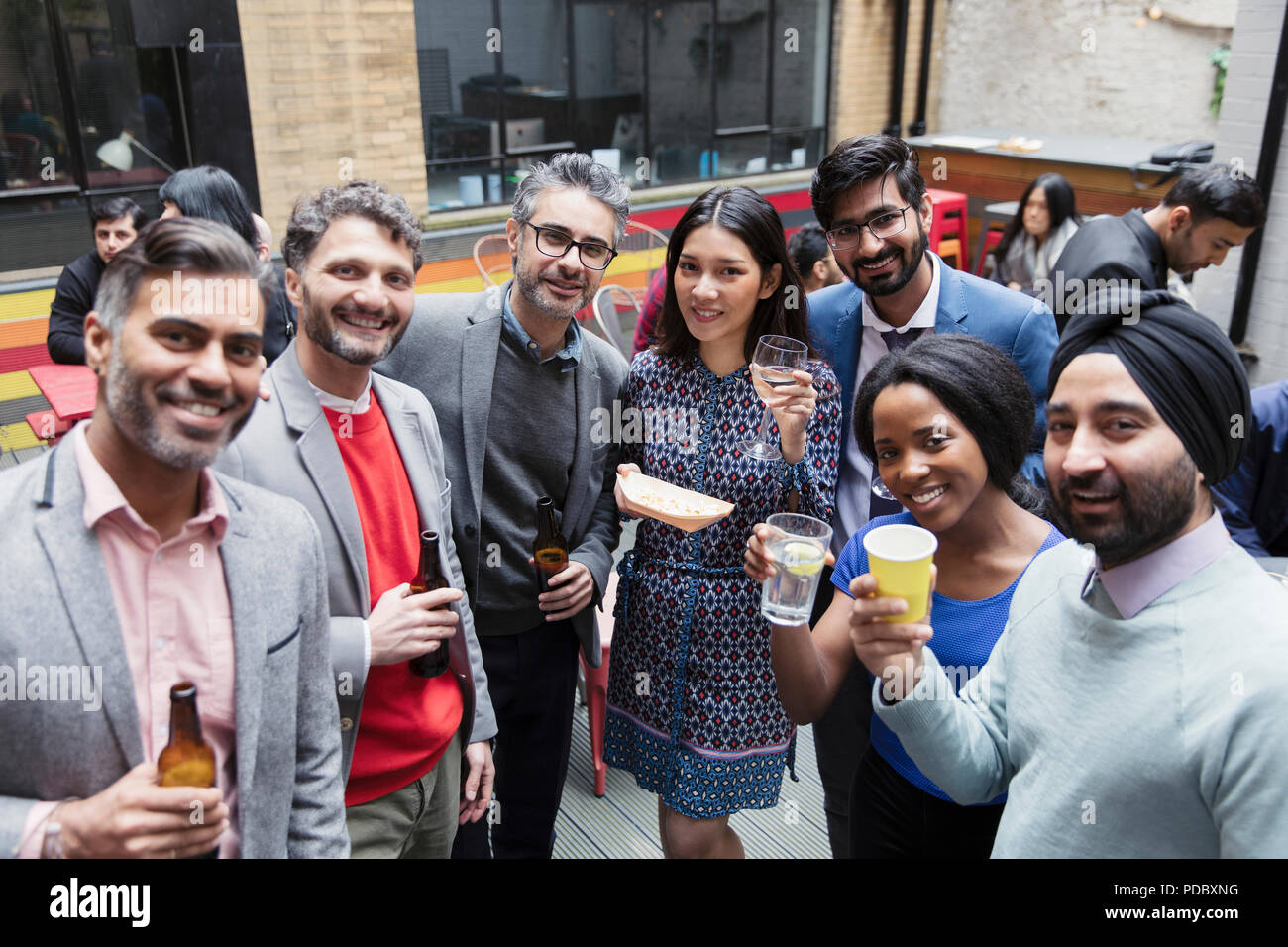 Portrait smiling friends drinking at party on patio Stock Photo - Alamy