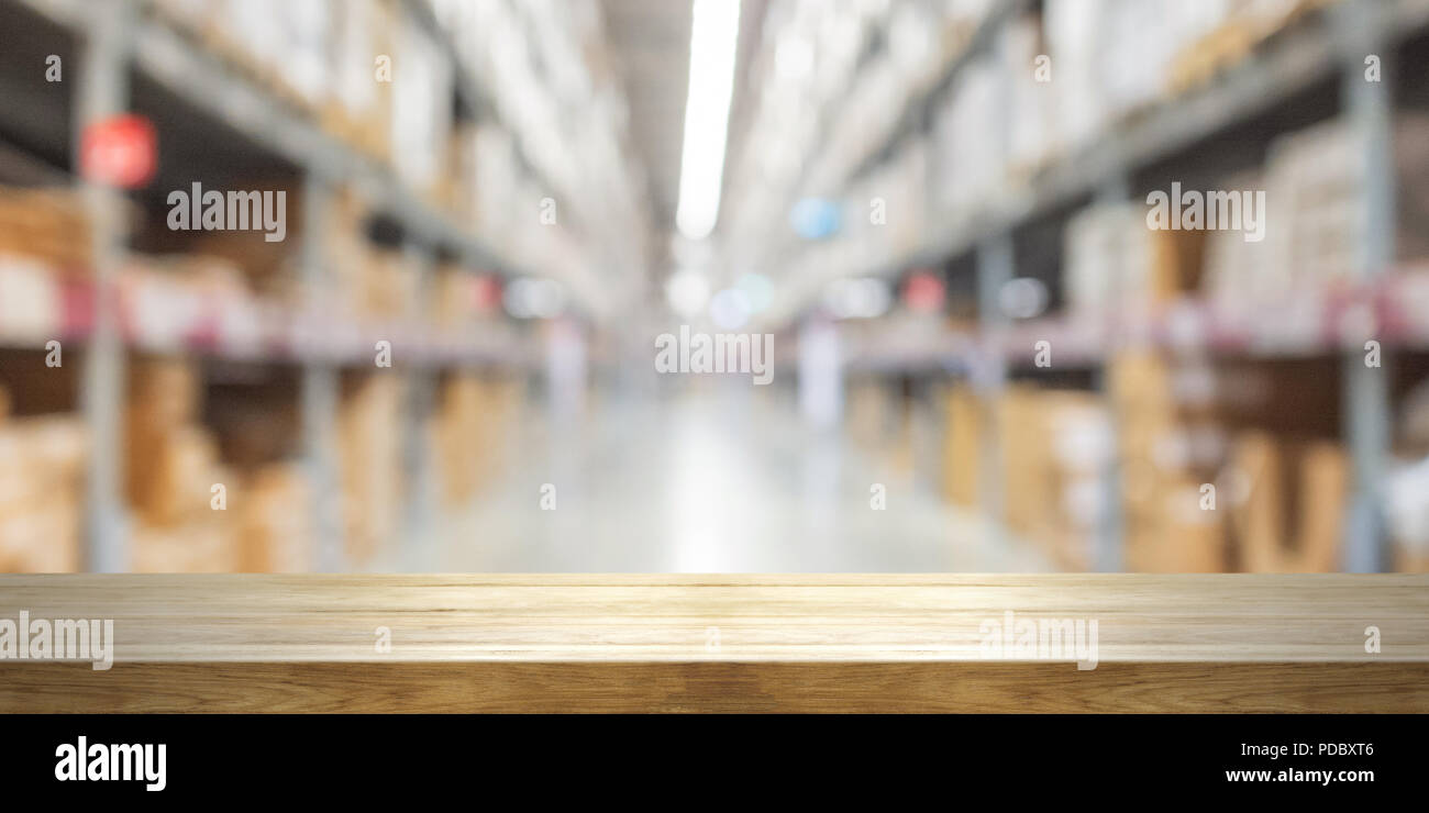 Empty wooden table top with blurred store background Stock Photo - Alamy