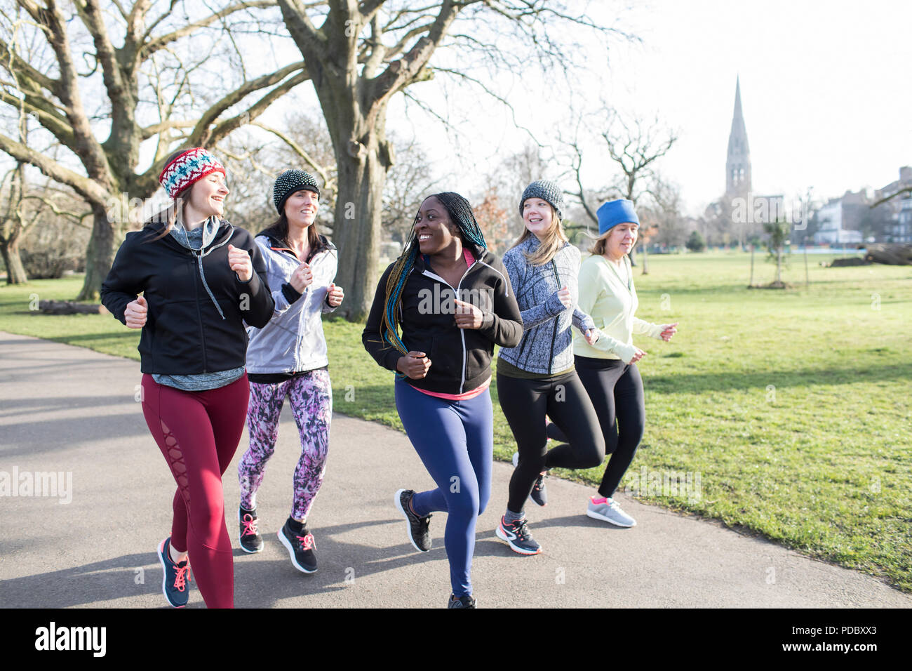 Group running listening hi-res stock photography and images - Alamy