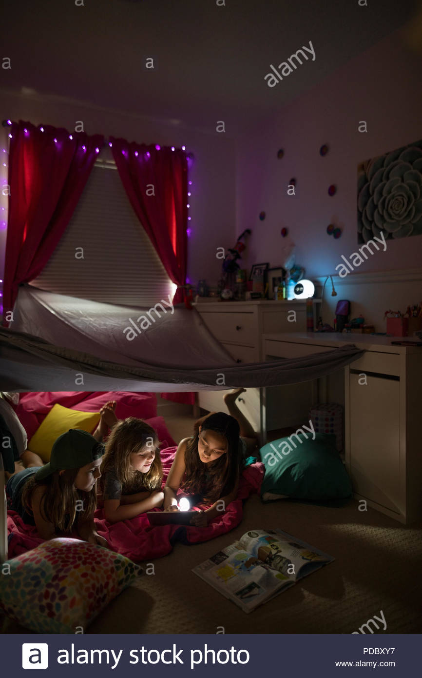 Reading using flashlight hi-res stock photography and images - Alamy