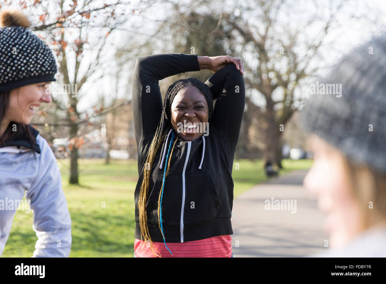 Laughing female runner holding hi-res stock photography and images - Alamy